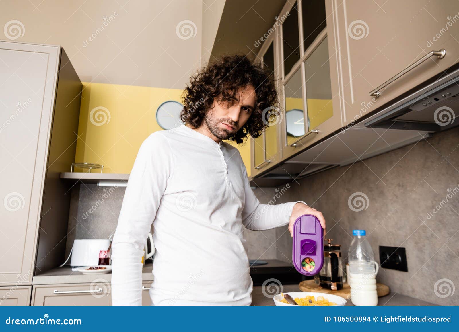 Sad Man Looking at Camera while Stock Photo - Image of morning, bowl ...