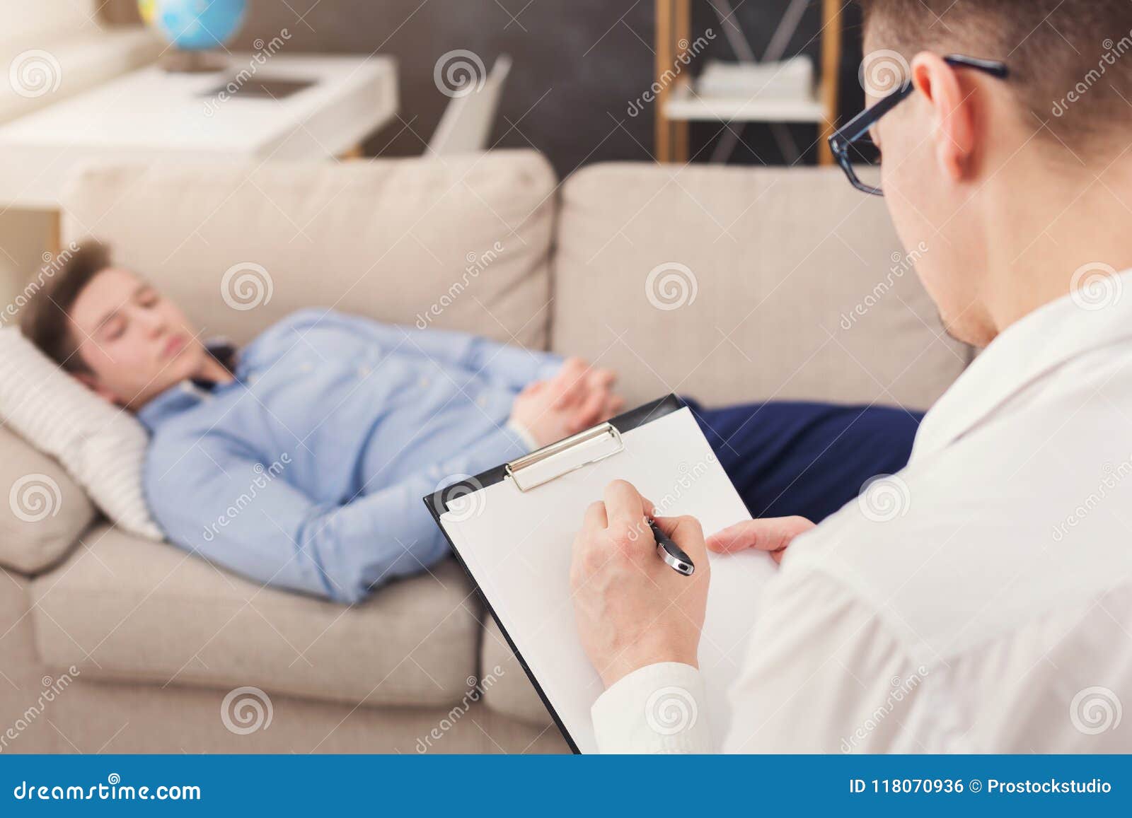 Sad Man Lying on Couch and Talking To Doctor Stock Photo - Image of ...