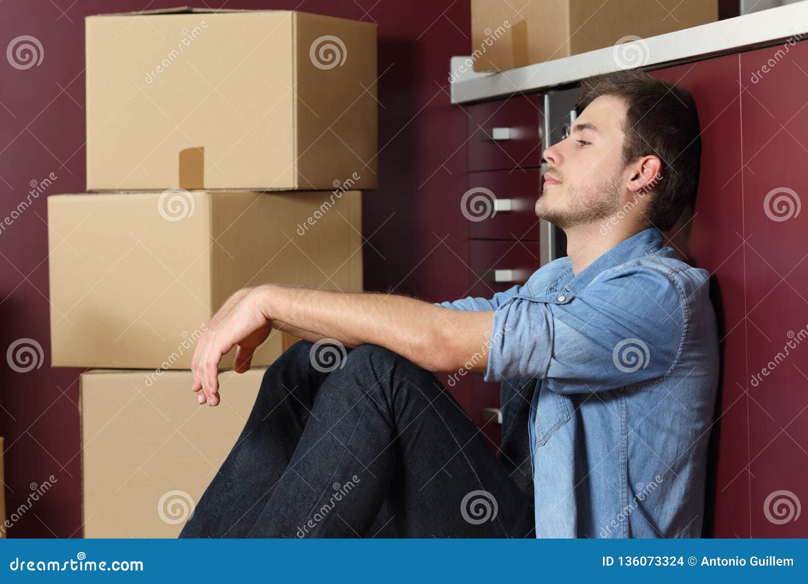 Sad Man Moving Home Sitting in the Kintchen Floor Stock Photo - Image ...