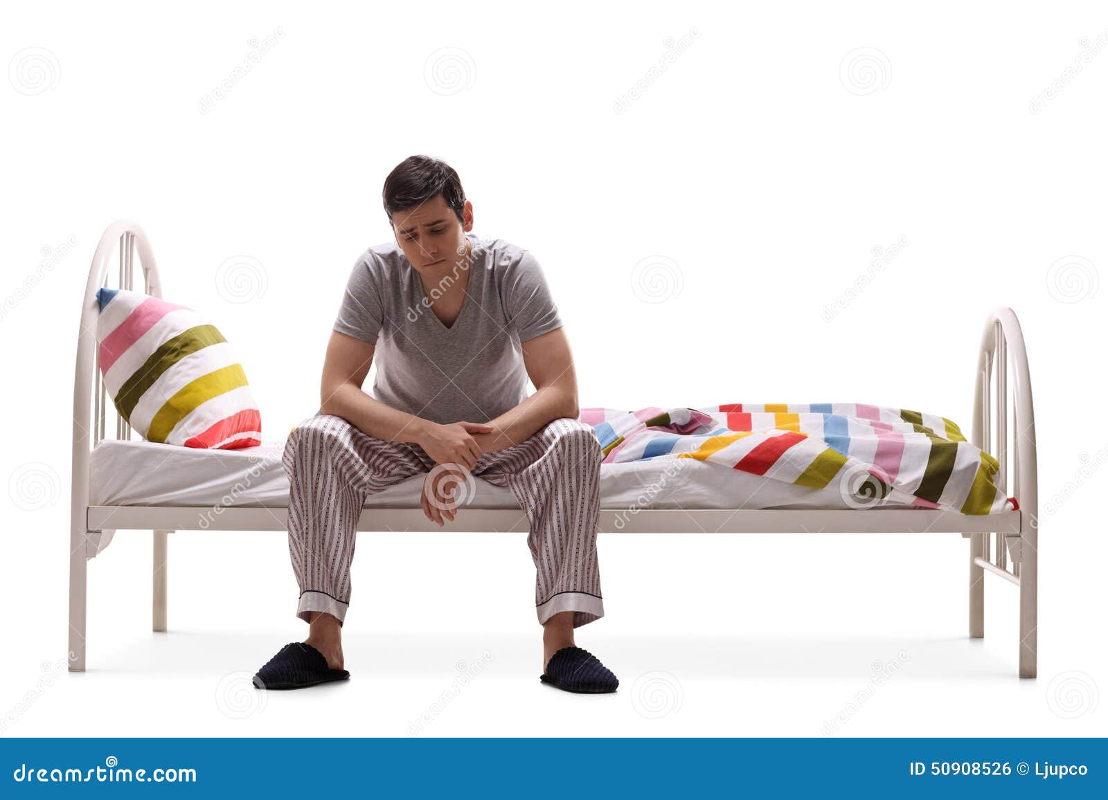 Sad Man in Pajamas Sitting on a Bed Stock Photo - Image of looking ...
