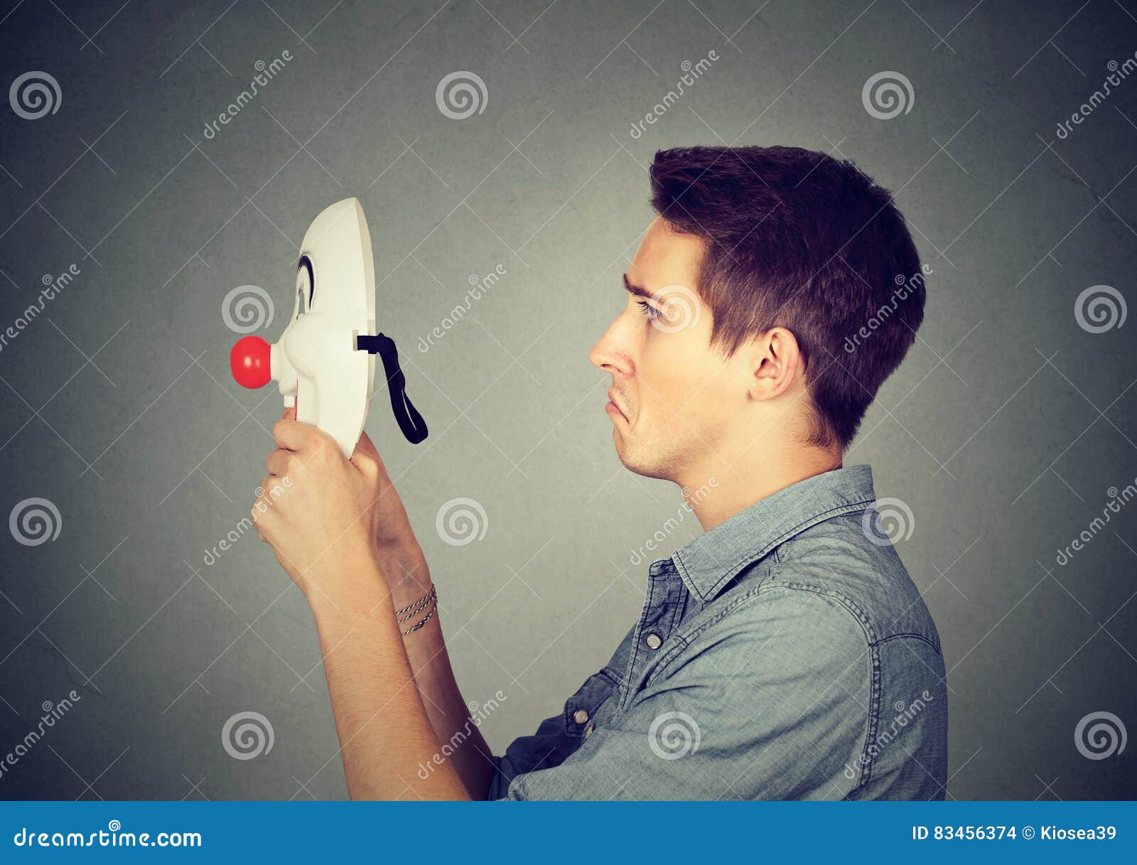 Sad Man Putting on Happy Mask Stock Photo - Image of mask, expression ...