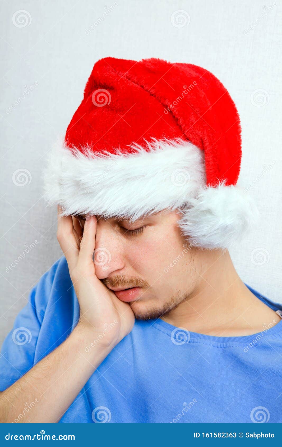 Sad Man in Santa Hat stock image. Image of pitiful, hurt - 161582363