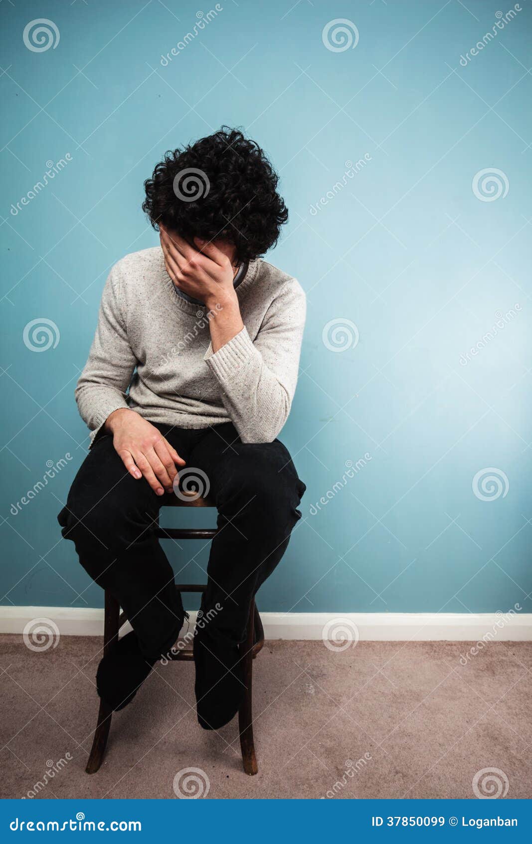 Sad man sitting on a chair stock image. Image of male - 37850099