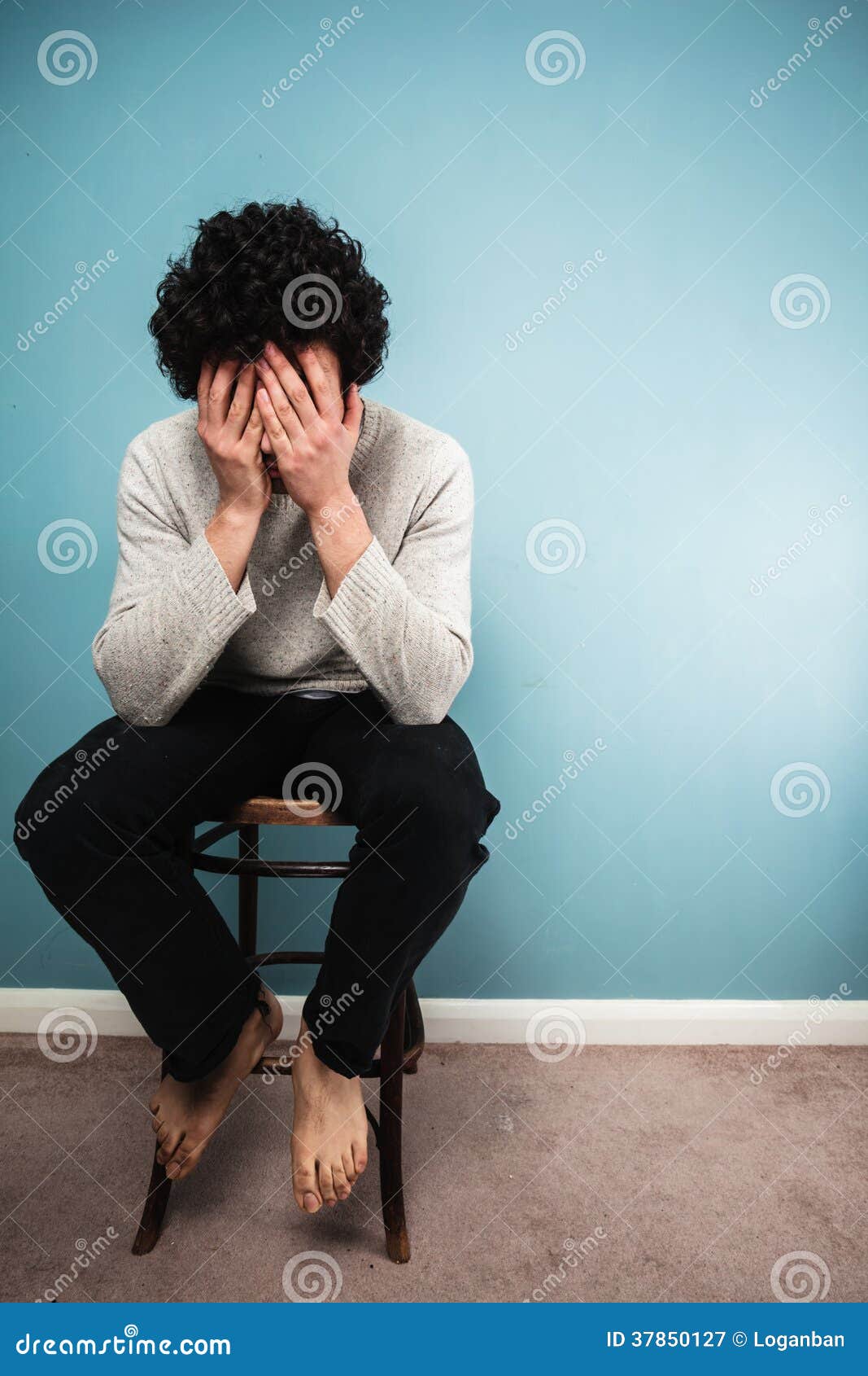 Sad man sitting on a chair stock image. Image of people - 37850127