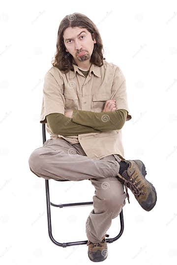 Sad man sitting on a chair stock photo. Image of full - 9032572