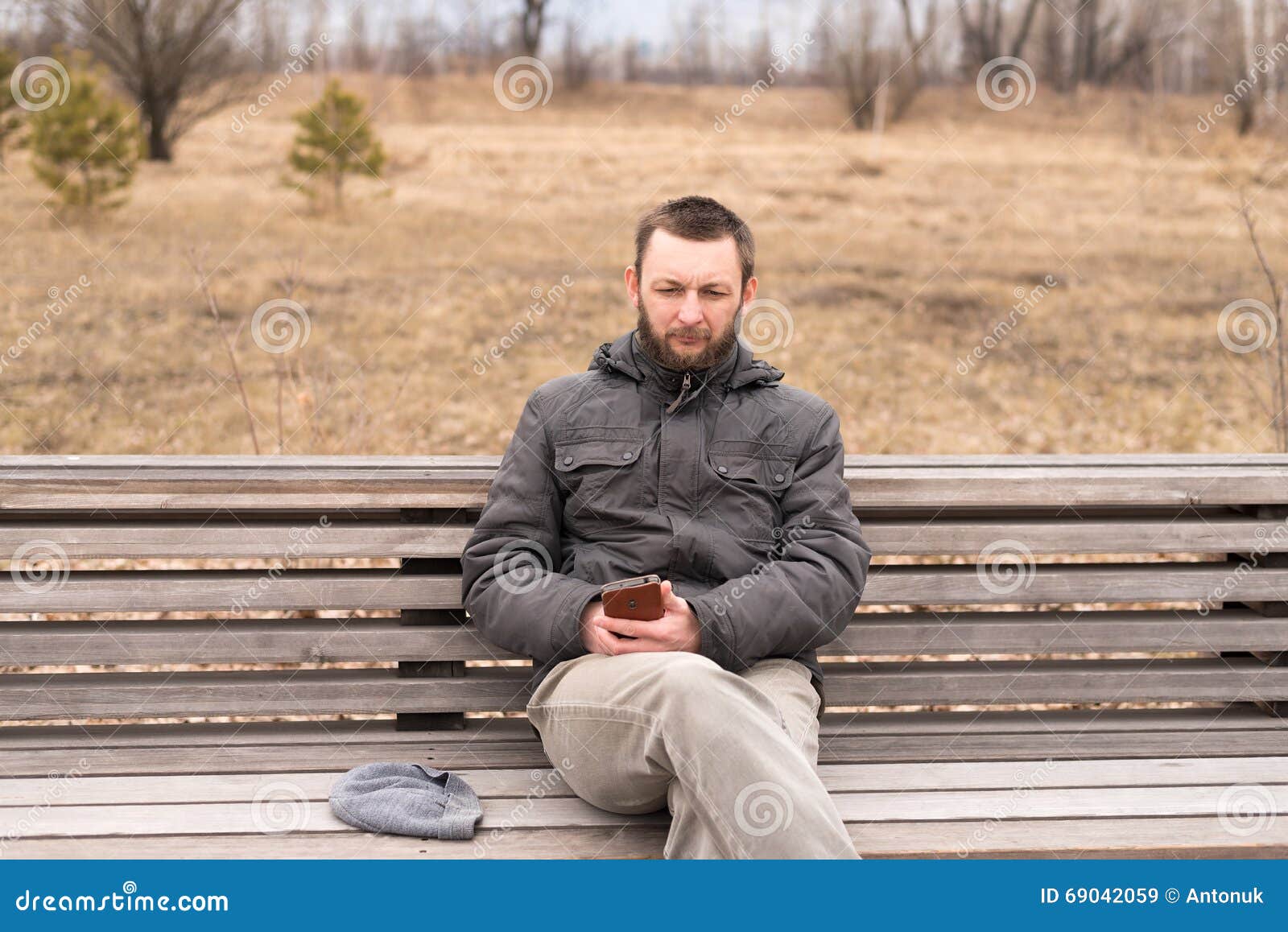 Sad Man with Smartphone on a Bench Stock Image - Image of serious ...