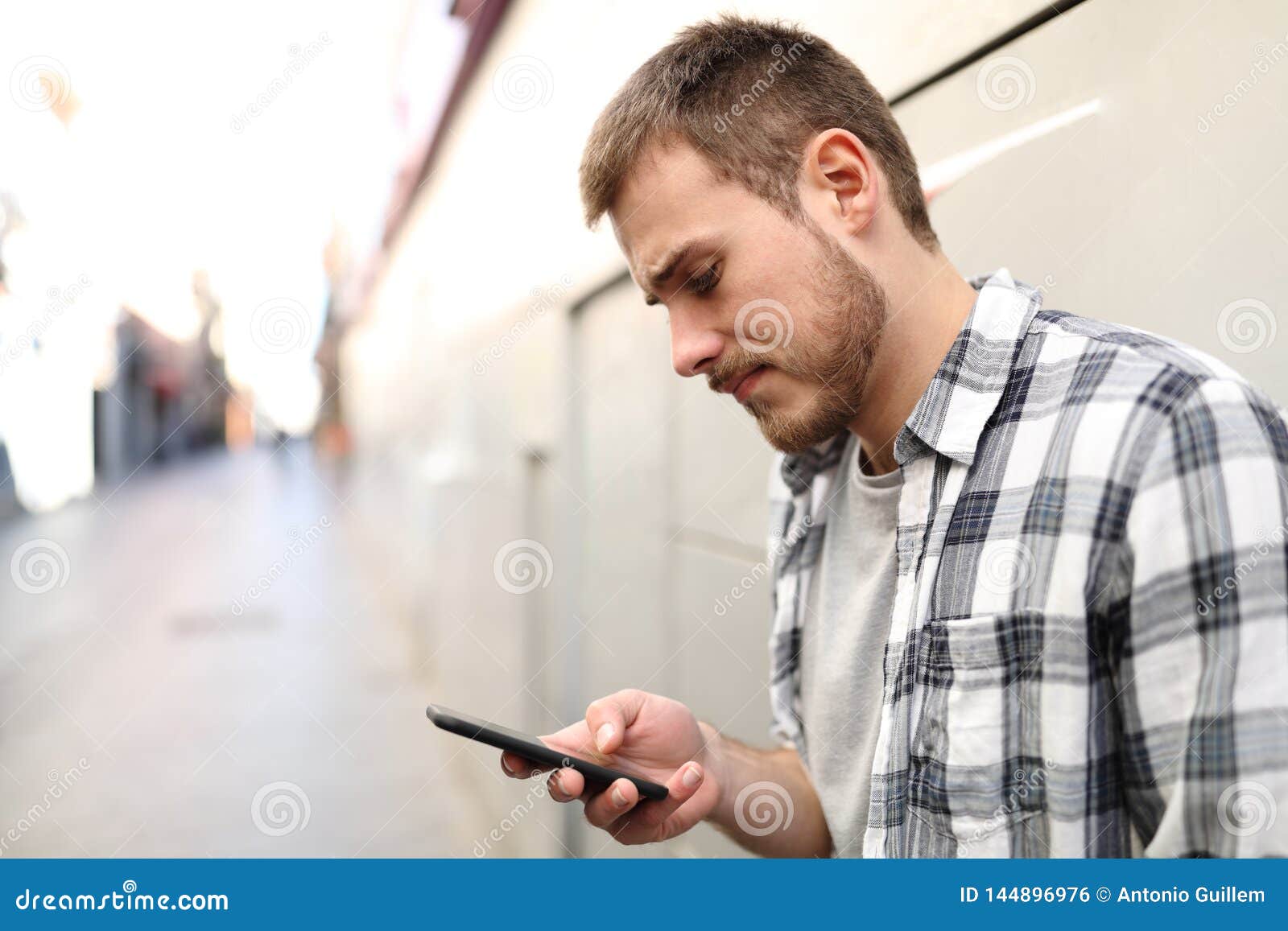 Sad Man in the Street Using a Smart Phone Stock Photo - Image of cell ...