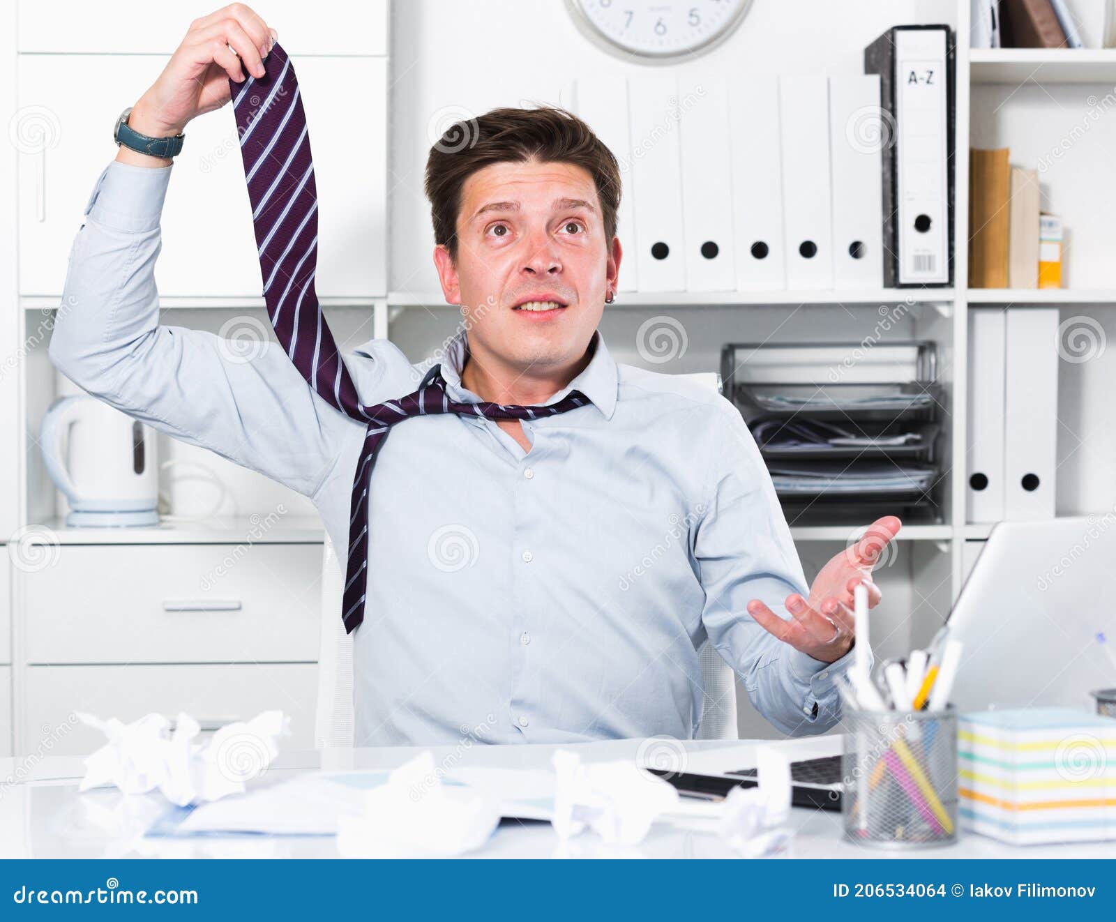 Sad man tired of working stock photo. Image of table - 206534064
