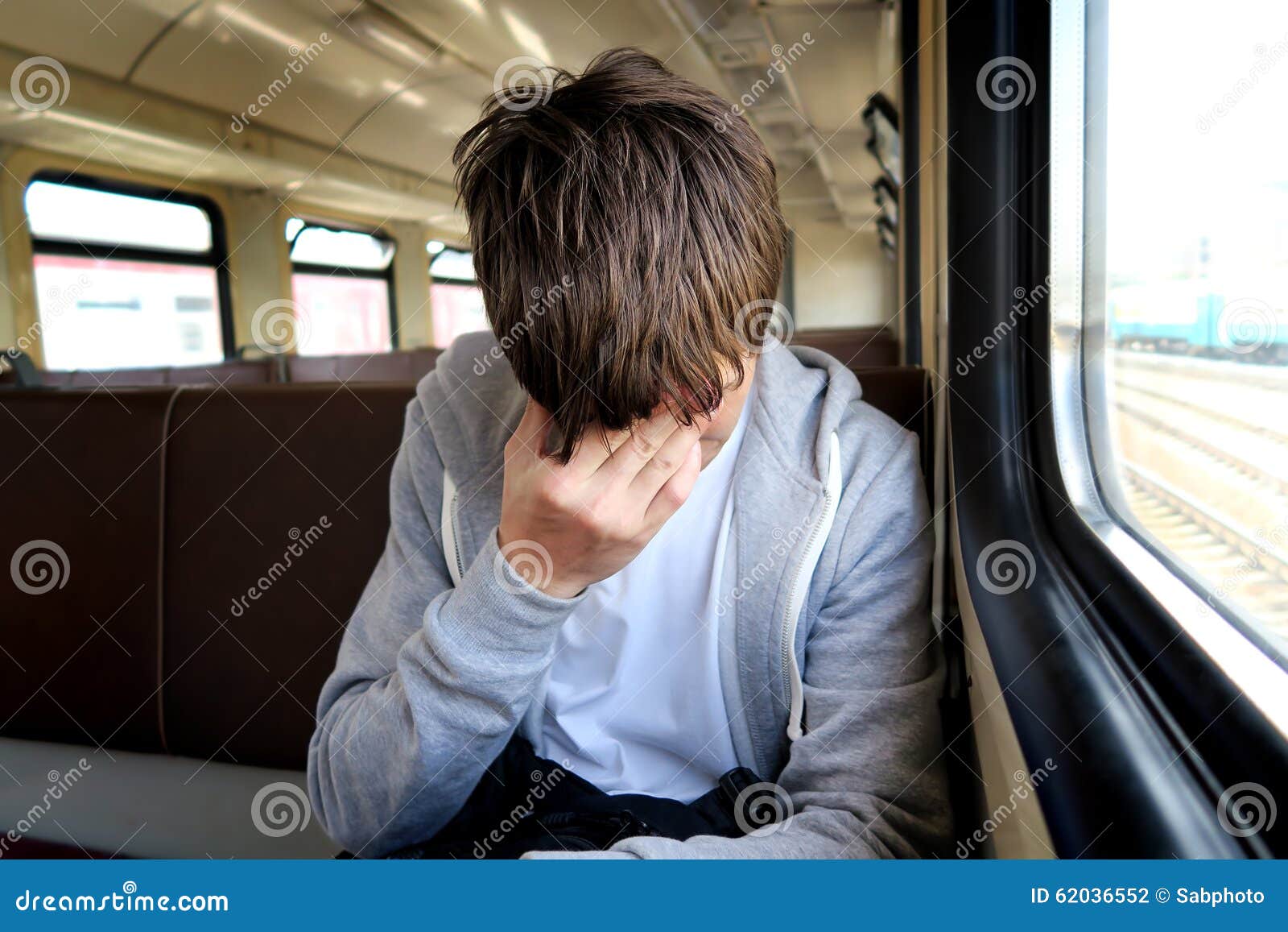 Sad Man in the Train stock photo. Image of electric, teenager - 62036552
