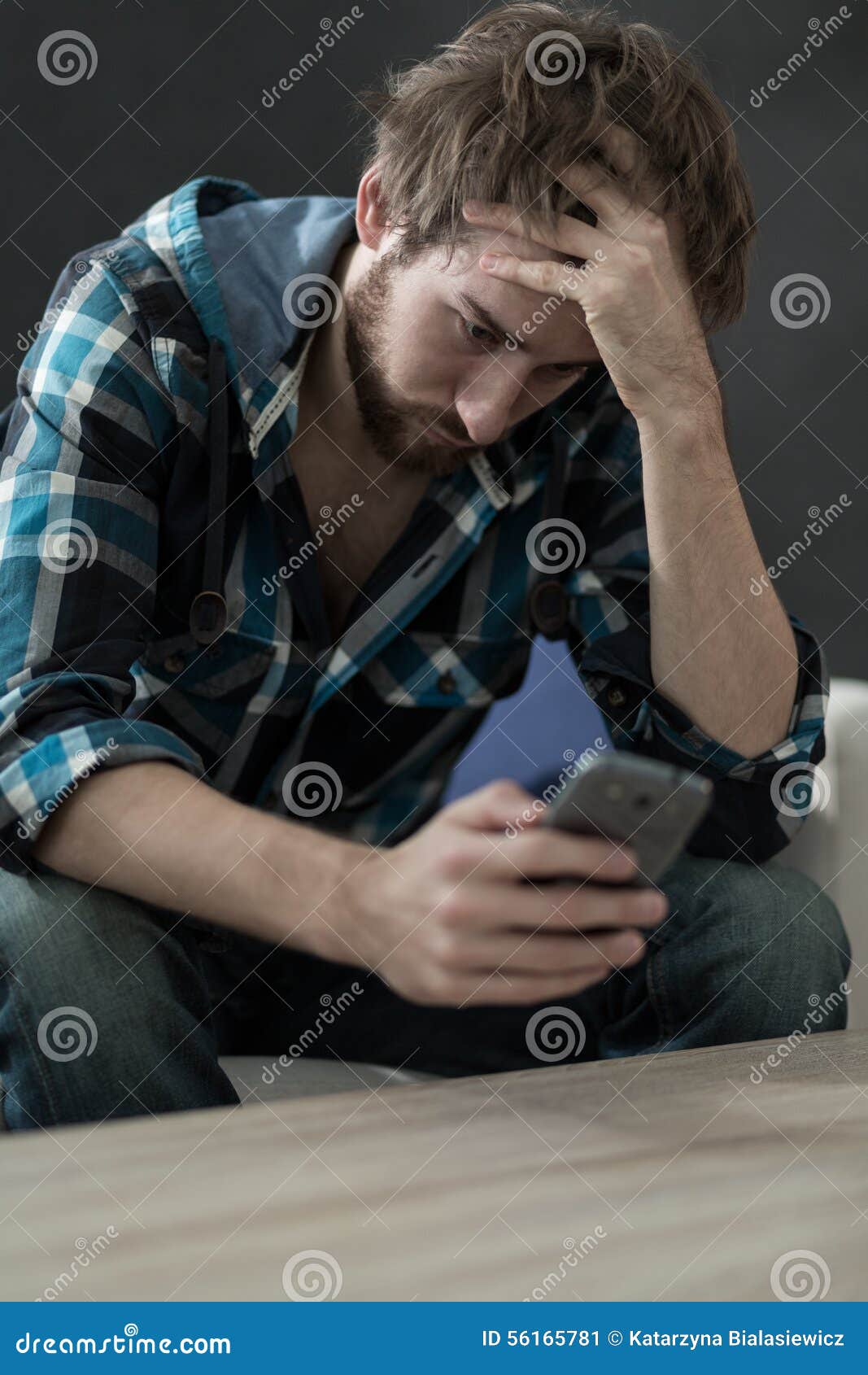 Really sad man using phone stock image. Image of caucasian - 56165781