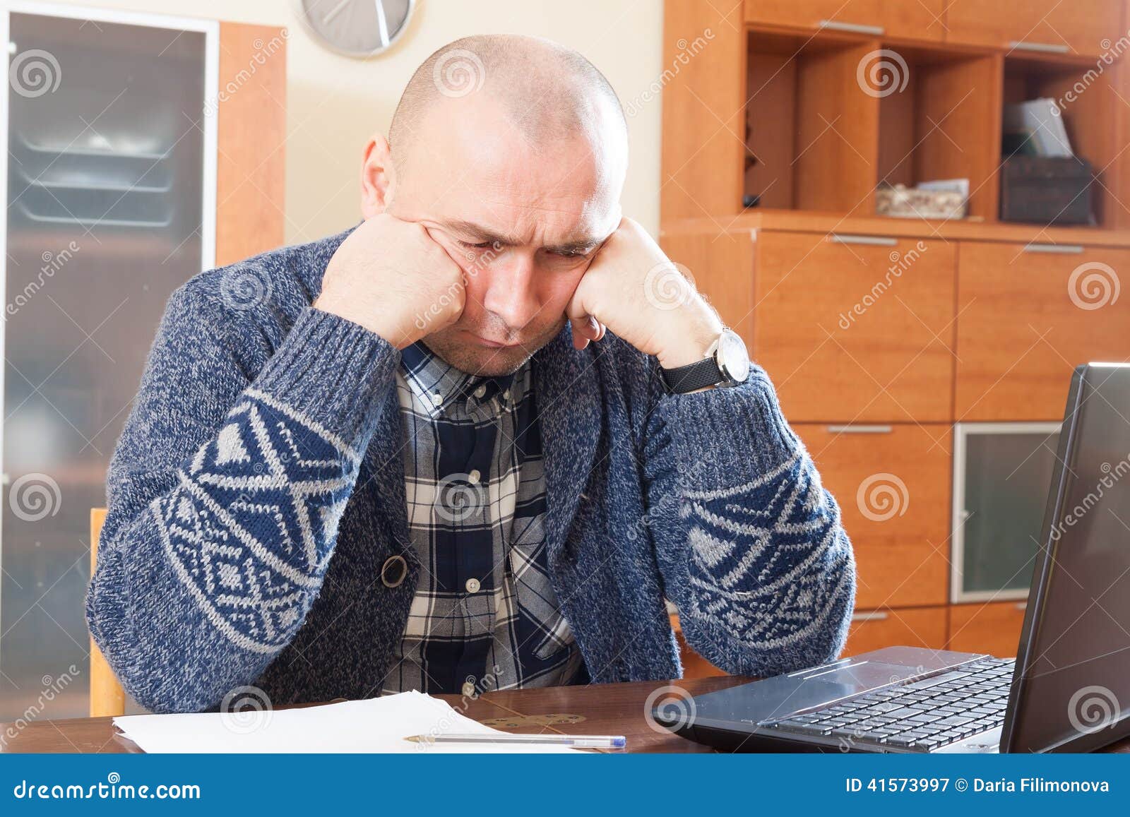Sad man at work on laptop stock image. Image of casual - 41573997
