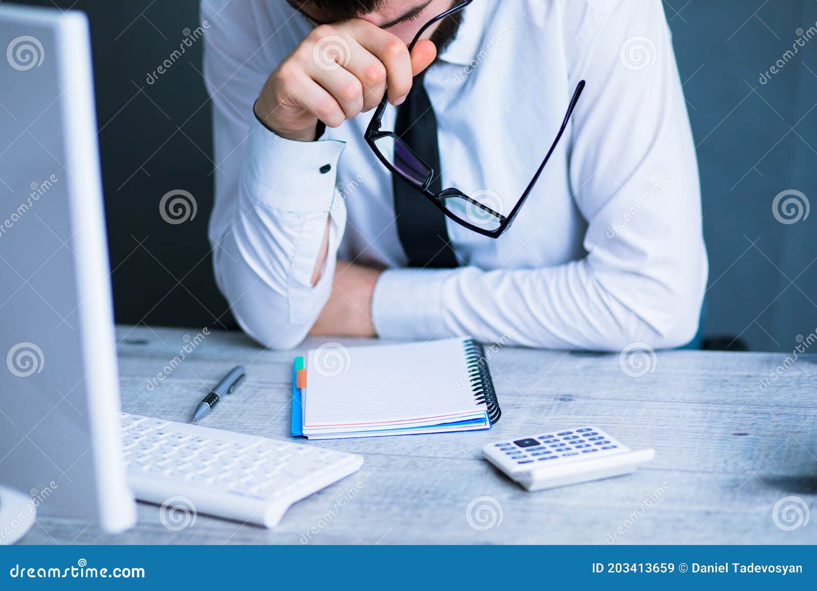 Sad man working in desk stock image. Image of corporate - 203413659
