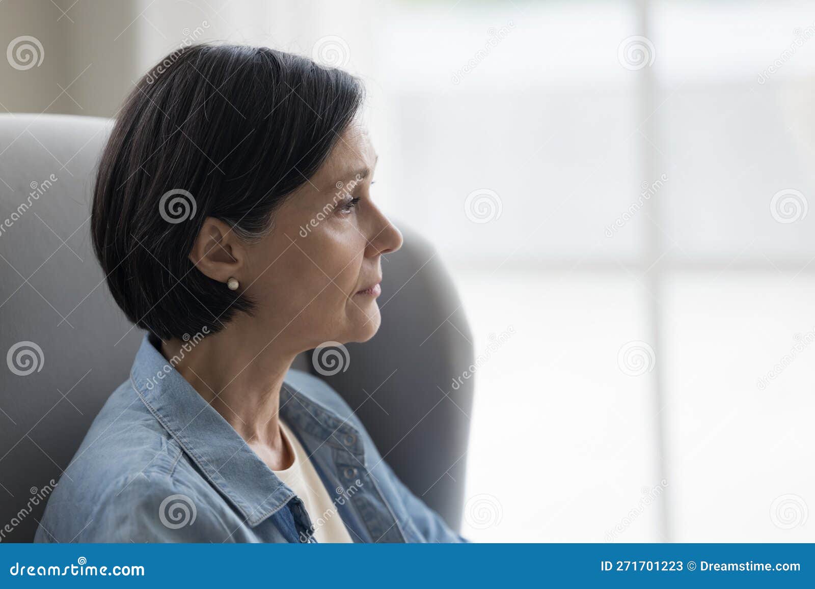 Sad Mature Black Haired Woman Looking Away In Deep Thoughts Stock Image