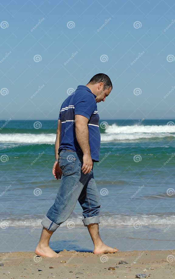 Sad Men Walking on the Beach Stock Photo - Image of outdoor, winter ...