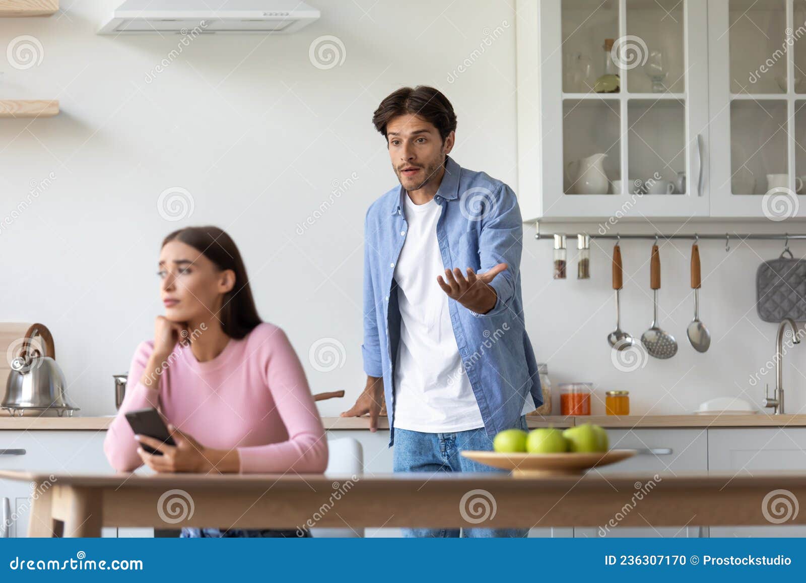 Sad Millennial European Woman With Smartphone Ignores Offended Angry