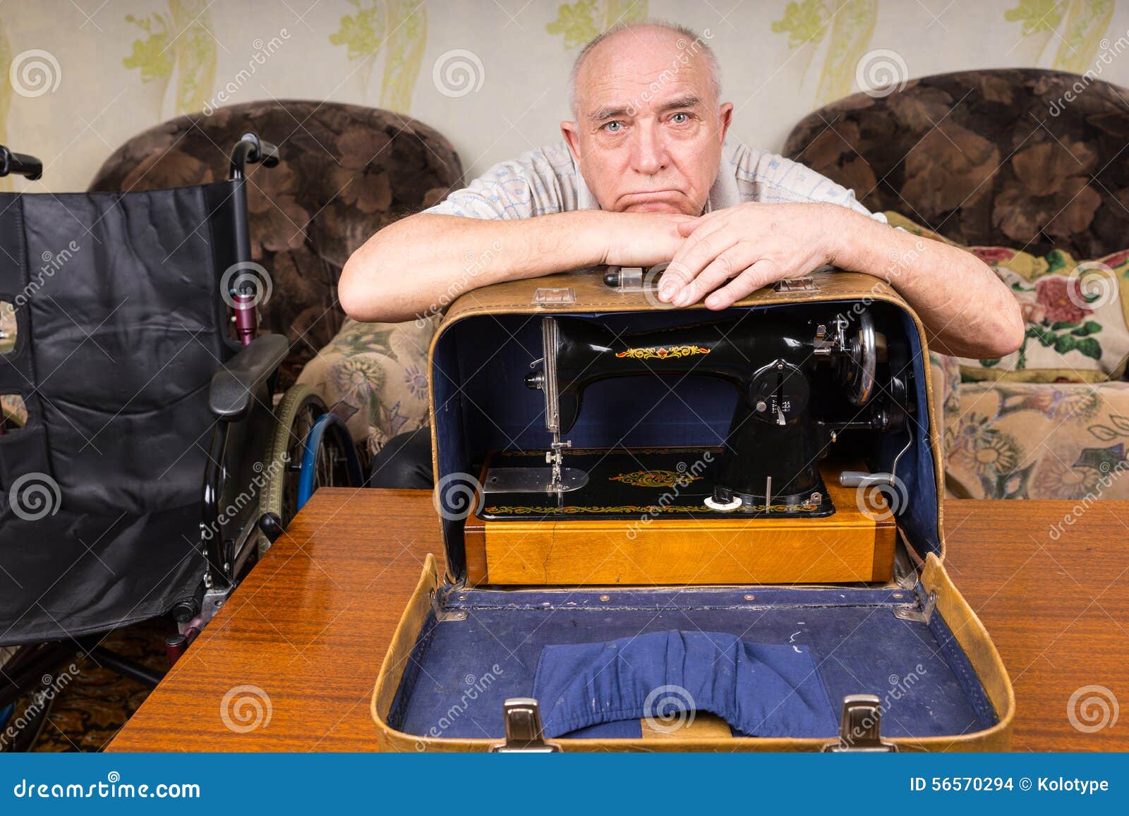 Sad Old Man Leaning on a Sewing Machine in a Case Stock Photo - Image ...