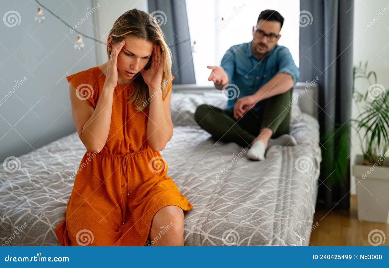 Sad Pensive Couple Thinking Of Relationships Problems Sitting On Sofa