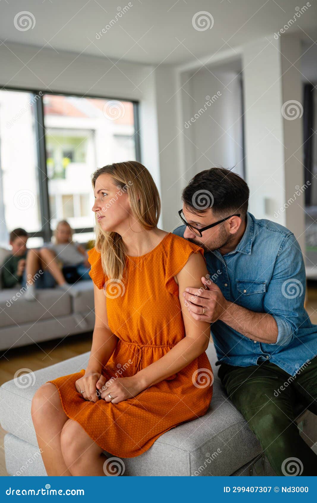 Sad Pensive Couple Thinking Of Relationships Problems Sitting On Sofa