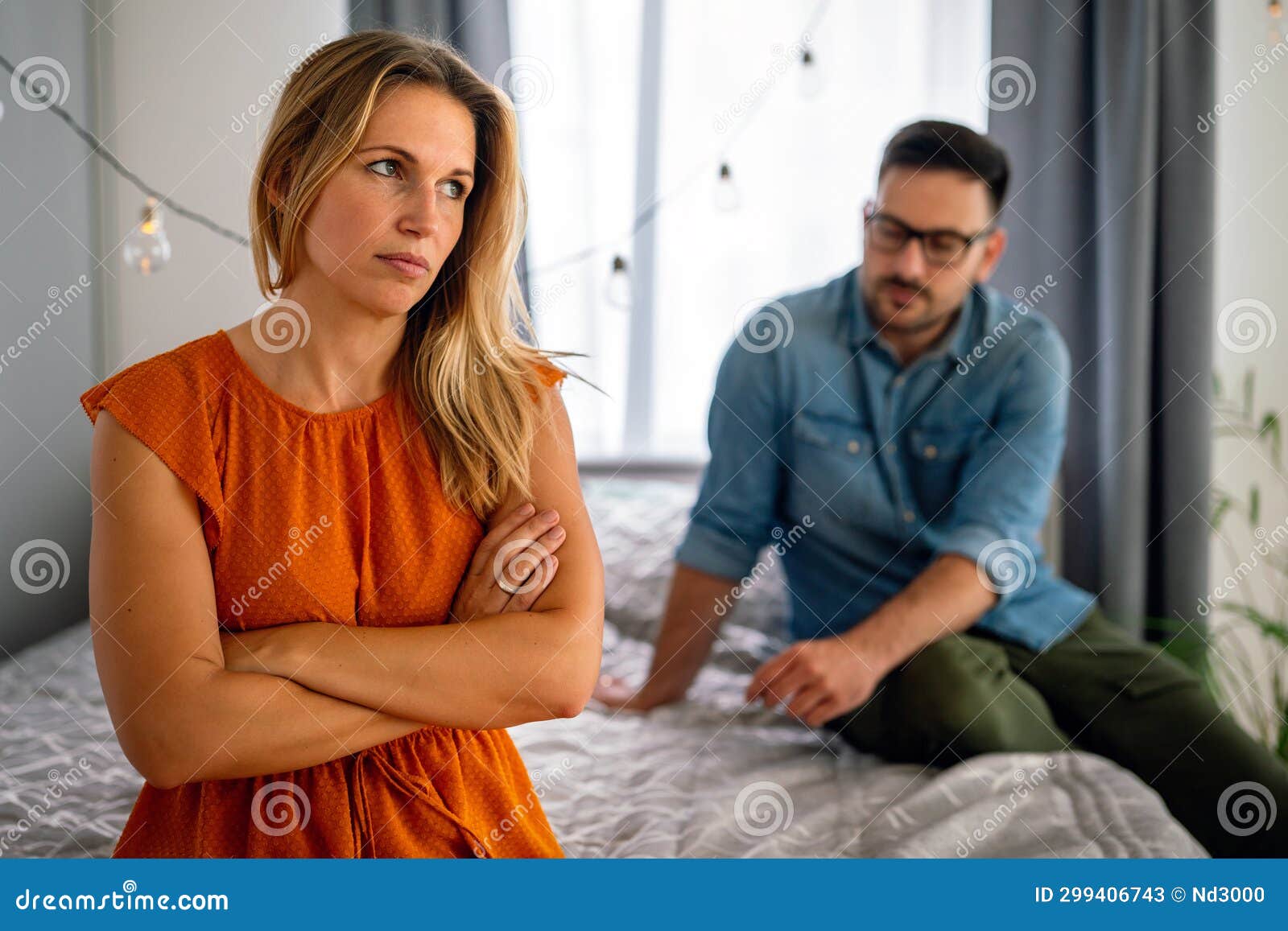 Sad Pensive Couple Thinking Of Relationships Problems Sitting On Sofa