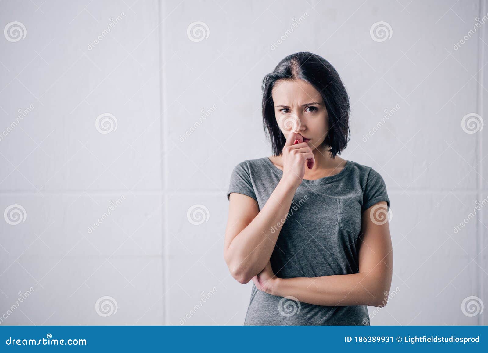 Pensive Woman Touching Chin and Looking at Camera Stock Image - Image ...
