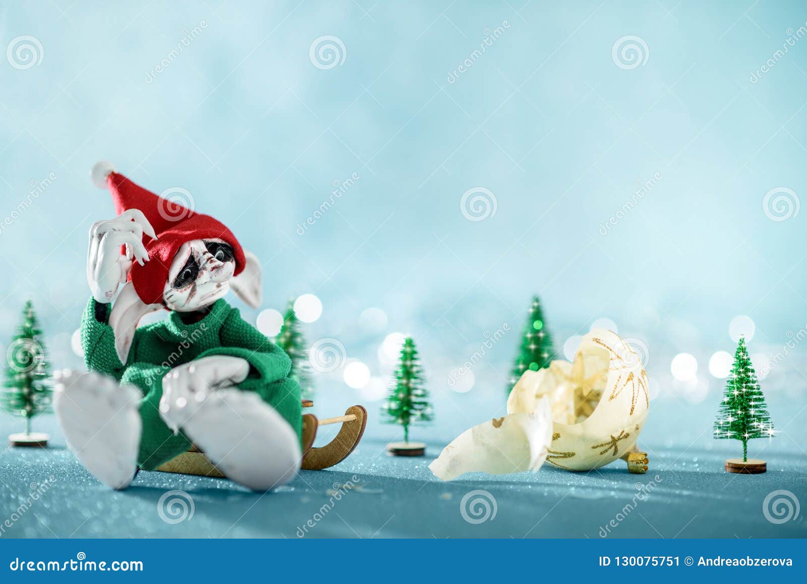 Sad Santas Helper Elf Sitting On Sledge Looking At Broken Christmas ...