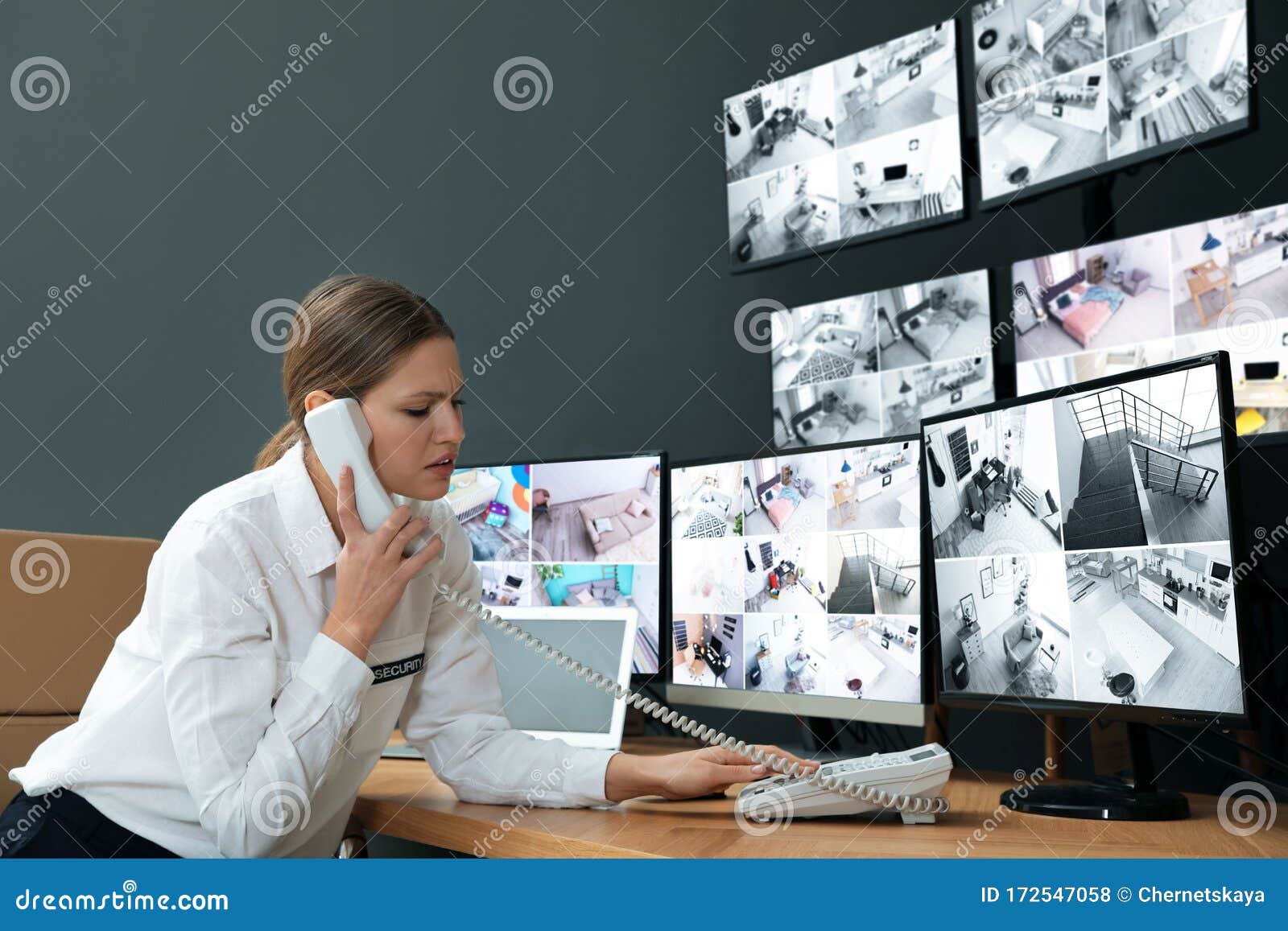 Sad Security Guard Talking on Telephone Workplace Stock Photo - Image ...