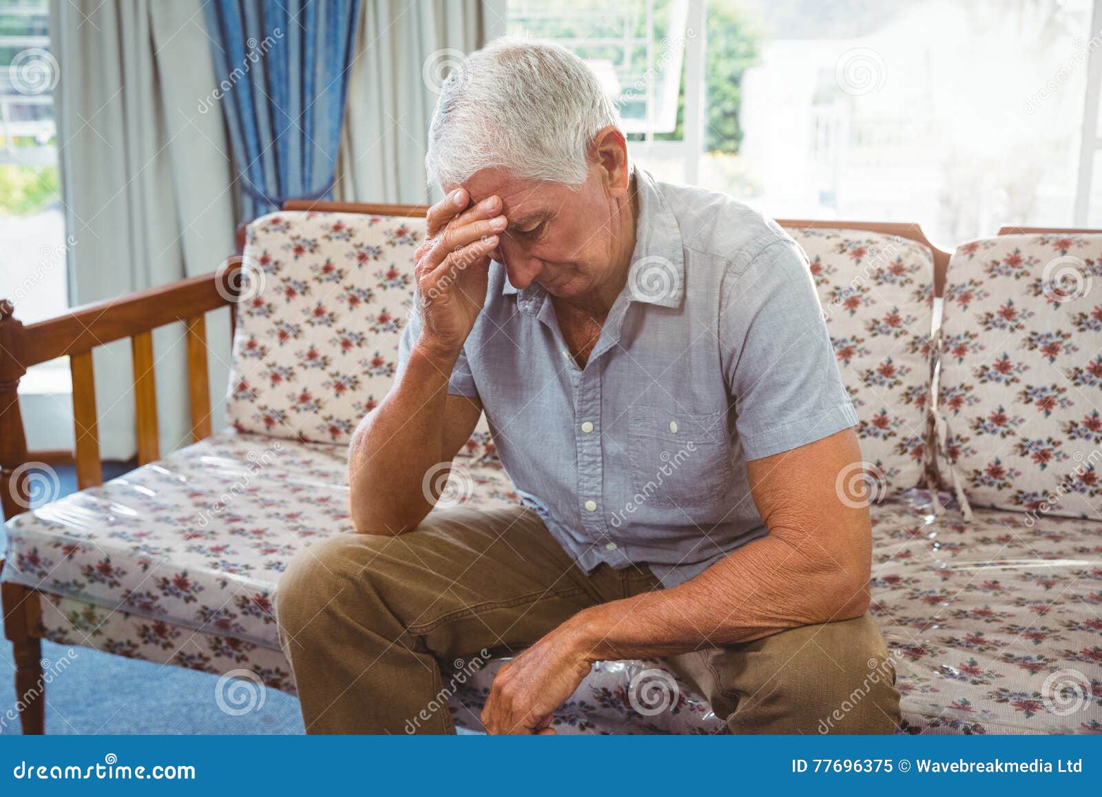 Sad Senior Man Sitting On A Couch Royalty-Free Stock Photography ...