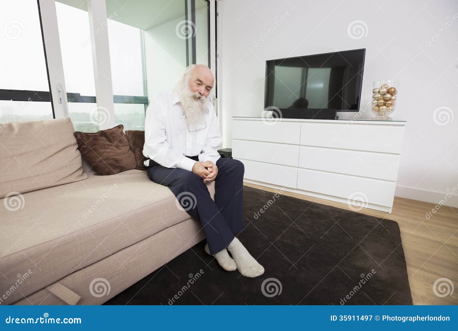 Sad Senior Man Sitting on Sofa in Living Room Stock Image - Image of ...