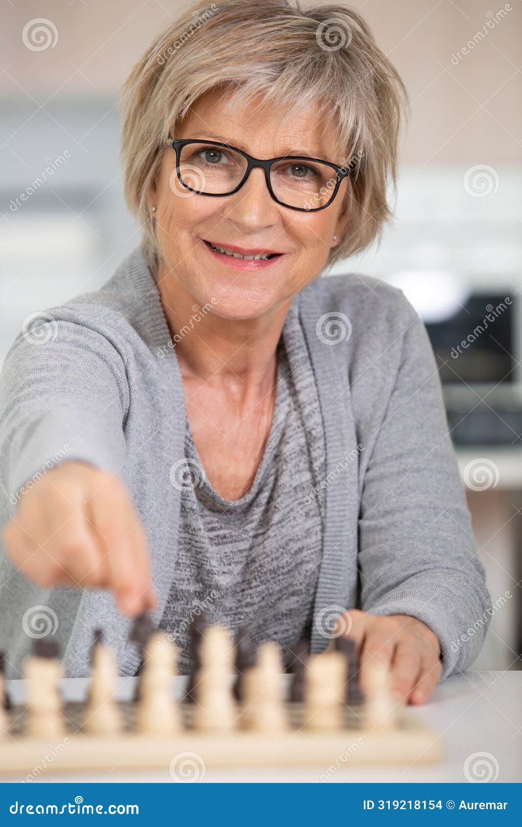 Sad Senior Woman Sitting at Table with Chess Stock Photo - Image of ...