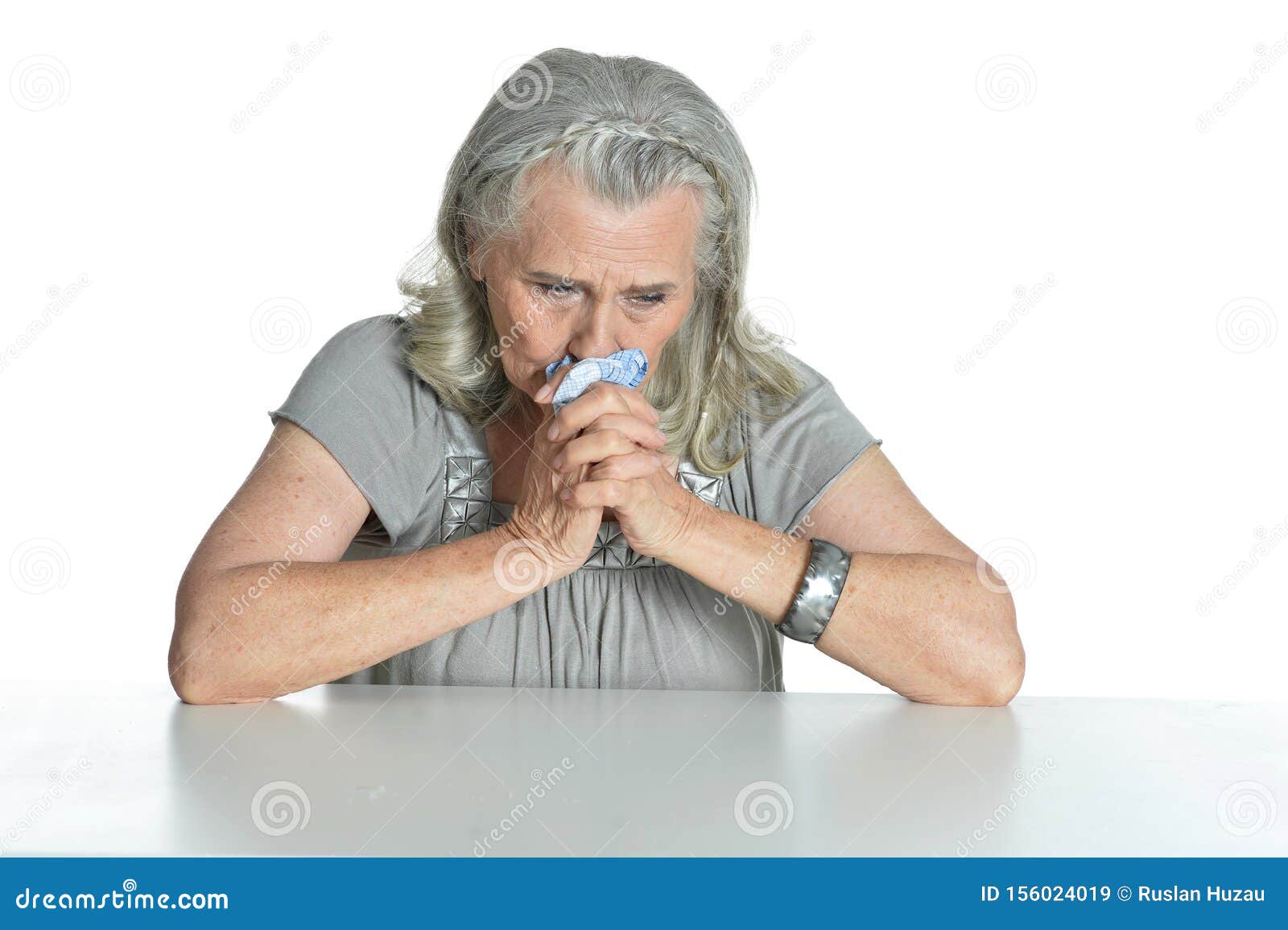 Sad Senior Woman at Table Isolated on White Background Stock Image ...