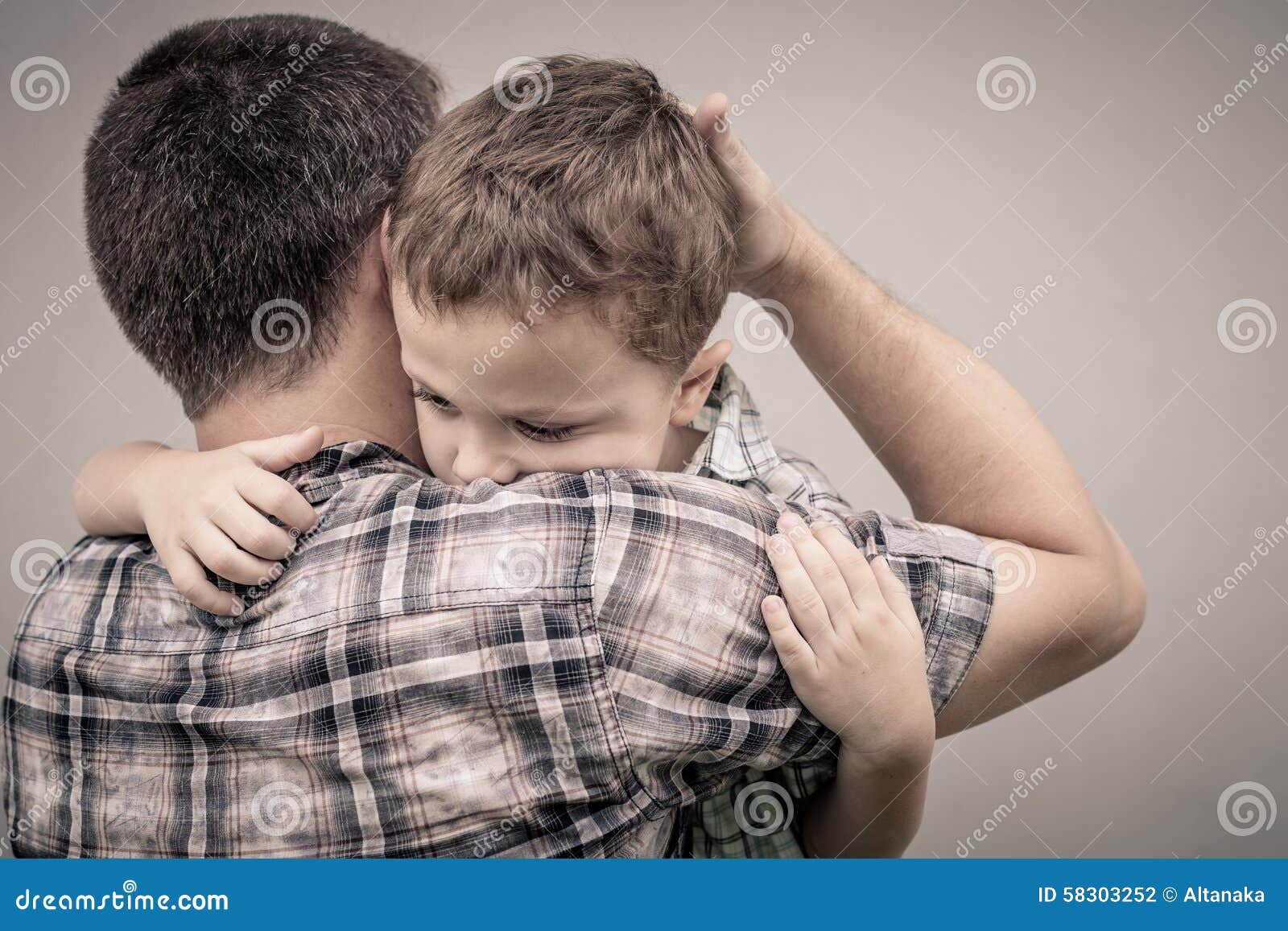 Sad son hugging his dad stock photo. Image of care, depression - 58303252