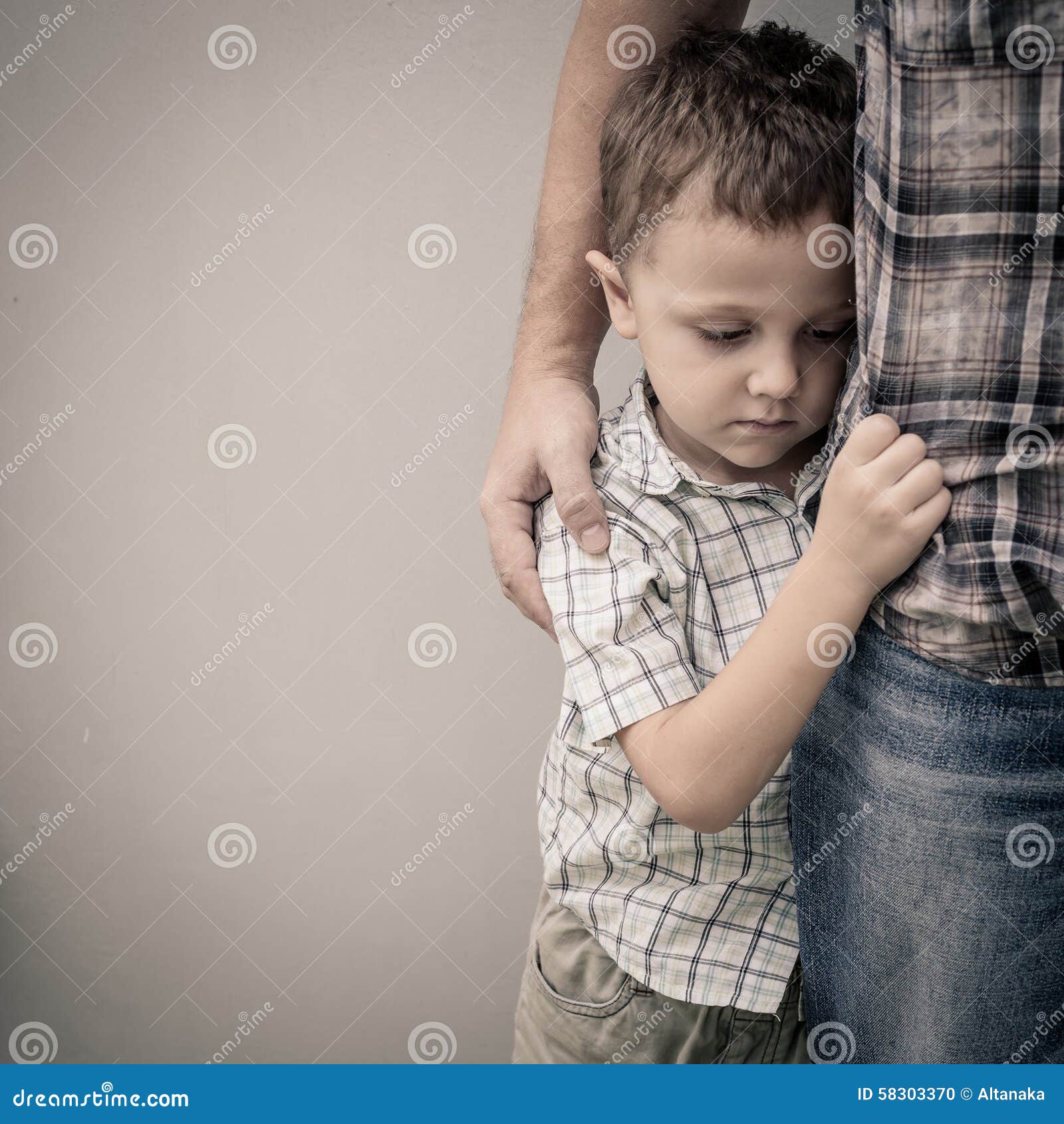 Sad son hugging his dad stock photo. Image of grief, adult - 58303370