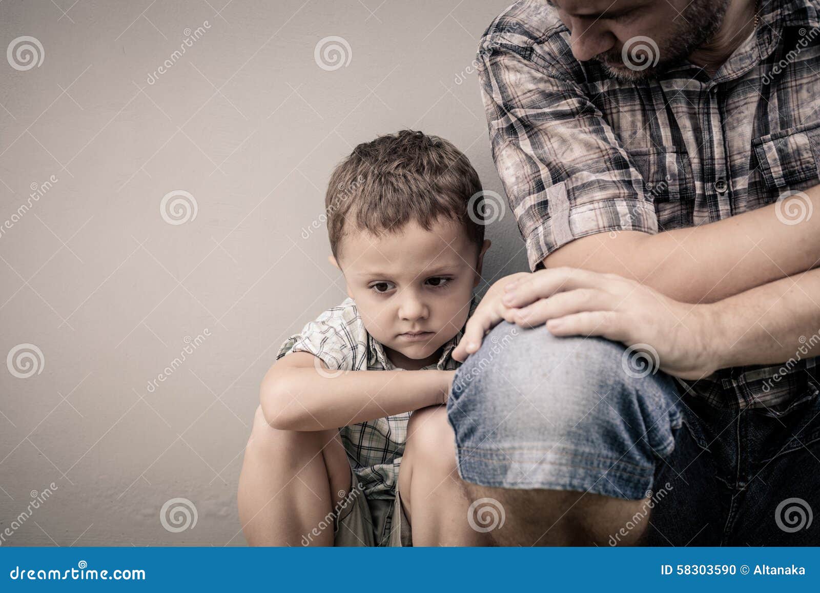 Sad son hugging his dad stock photo. Image of pain, help - 58303590