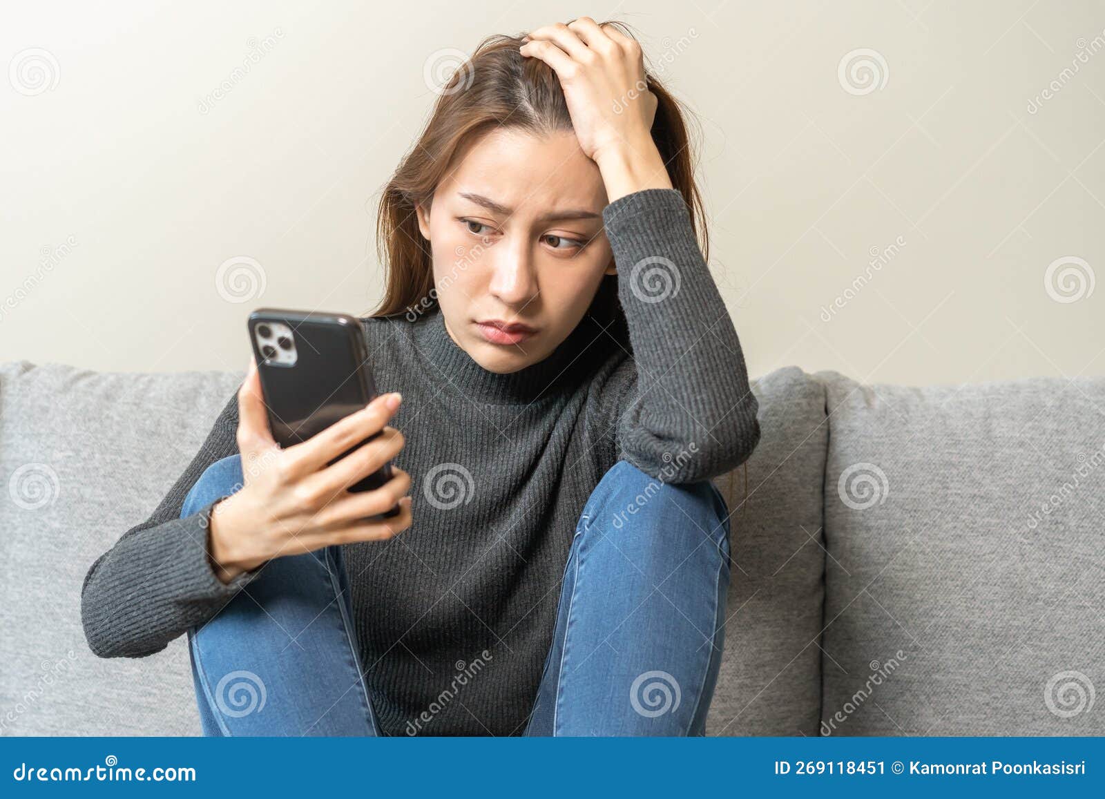 Sad, Sorrow Asian Young Woman Looking at Screen on Mobile Phone ...