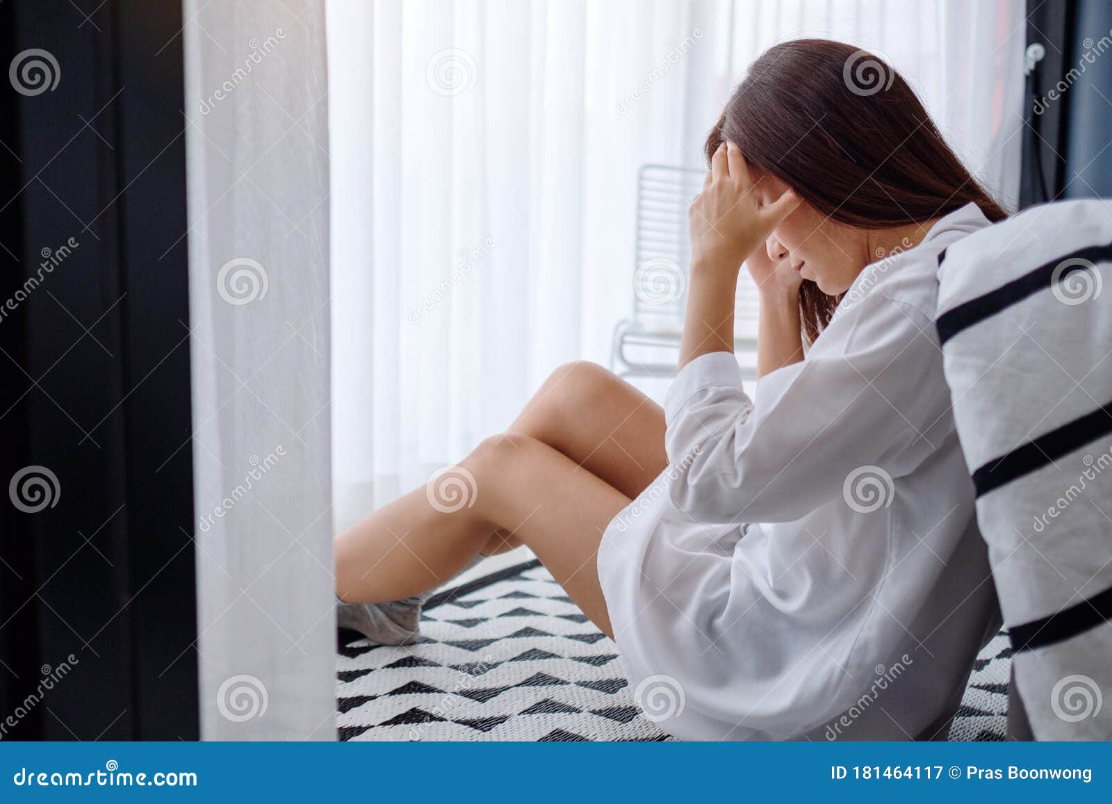 A Sad And Stressed Young Woman Sitting Alone In Bedroom Stock Image Image Of Anxious Feelings