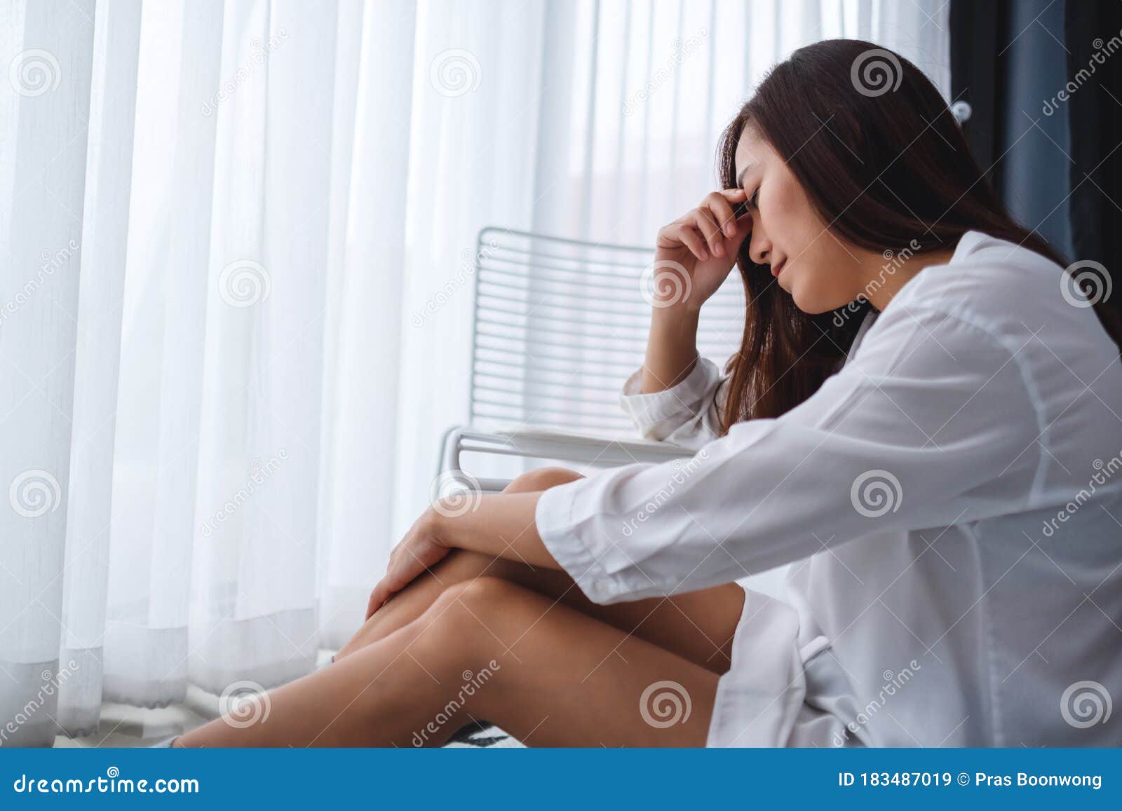 A Sad And Stressed Young Woman Sitting Alone In Bedroom Stock Image Image Of Disappointment