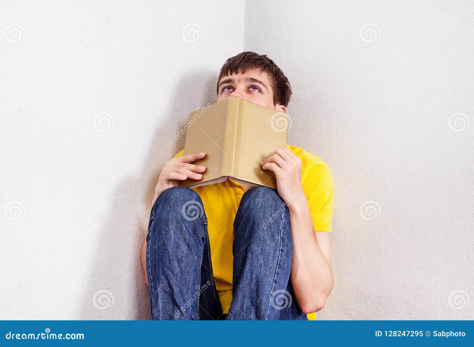 Sad Student with a Book stock image. Image of pray, student - 128247295