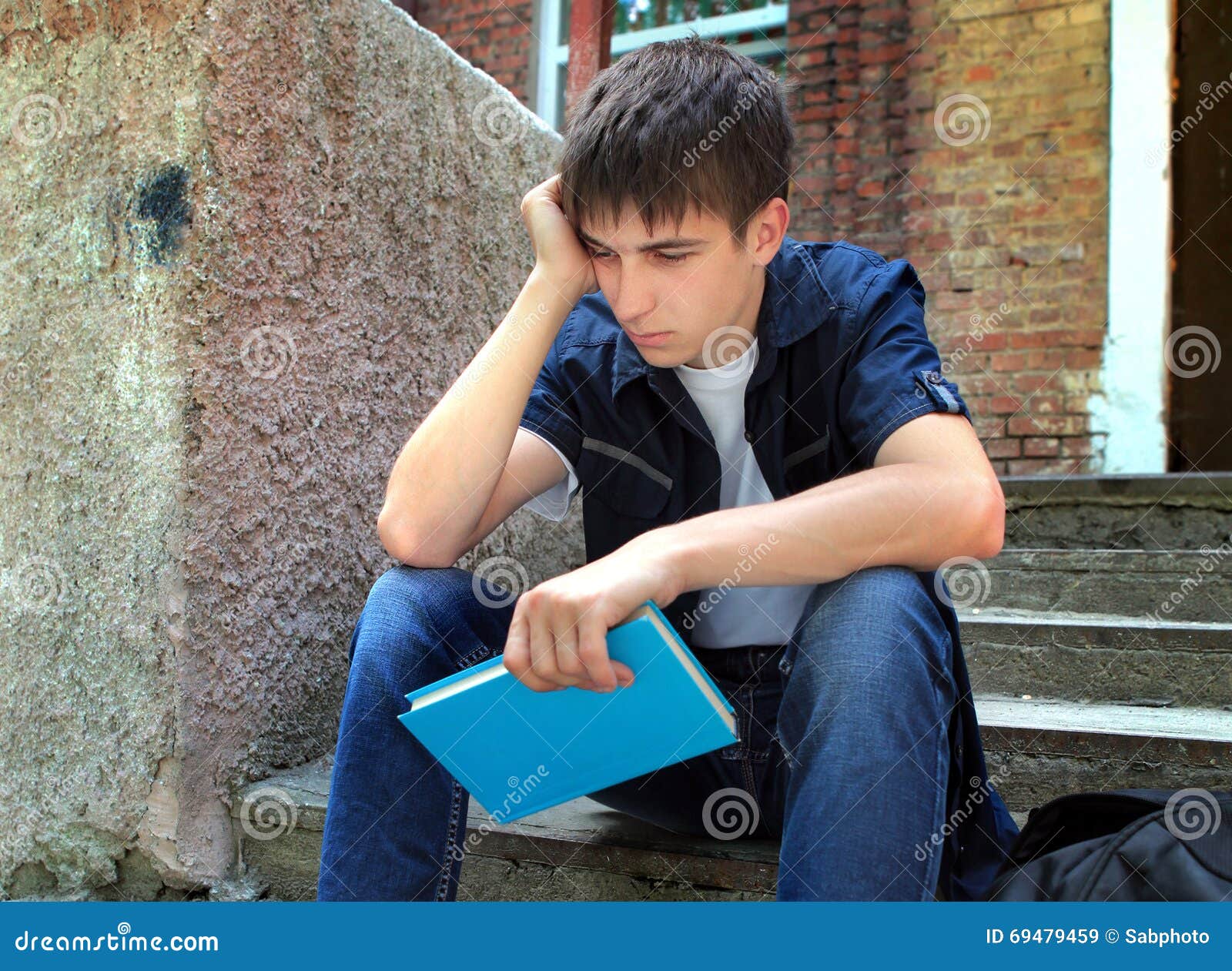 Sad Student with a Book stock image. Image of outcast - 69479459