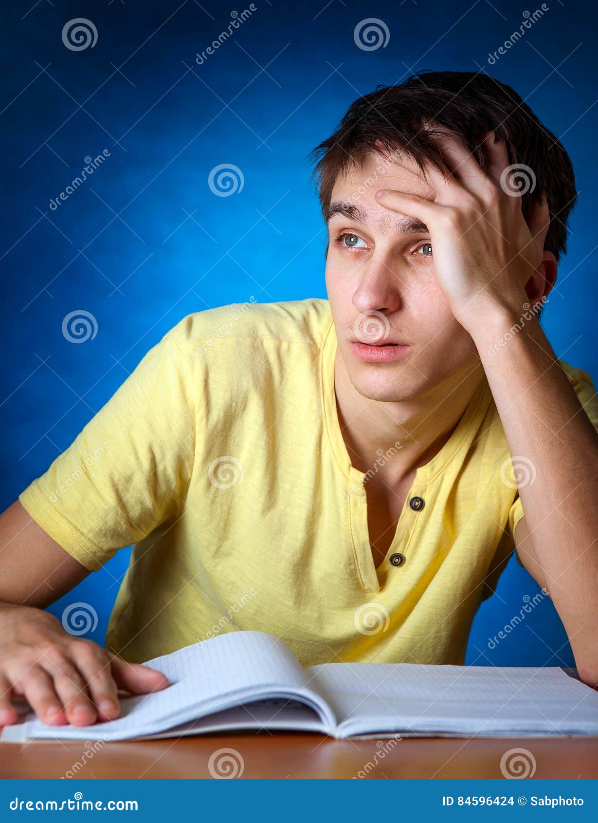 Sad Student with the Book stock photo. Image of grief - 84596424