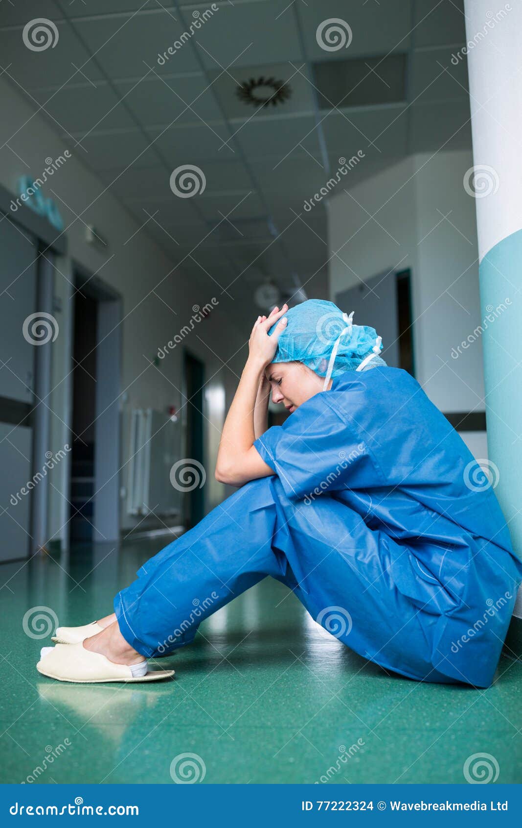 Sad Surgeon Sitting on Floor in Corridor Stock Photo - Image of sadness ...