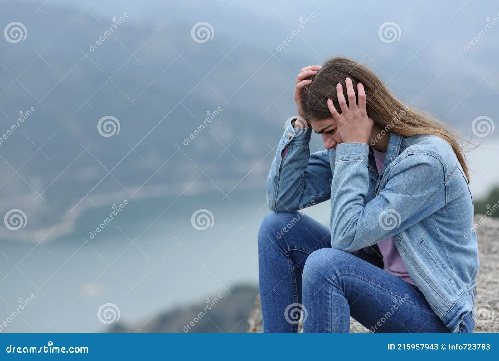 Sad Teen Complaining Alone in a Cliff Stock Image - Image of cliff ...