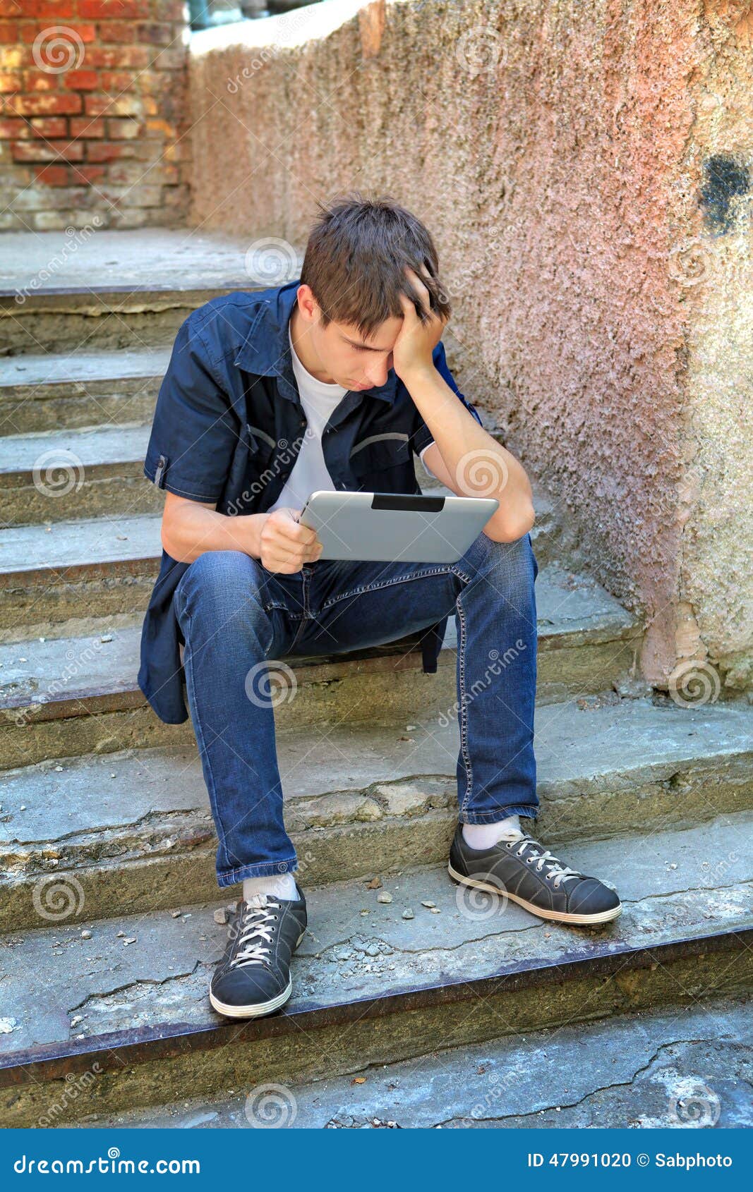 Sad Teenager with Tablet Computer Stock Photo - Image of computer ...