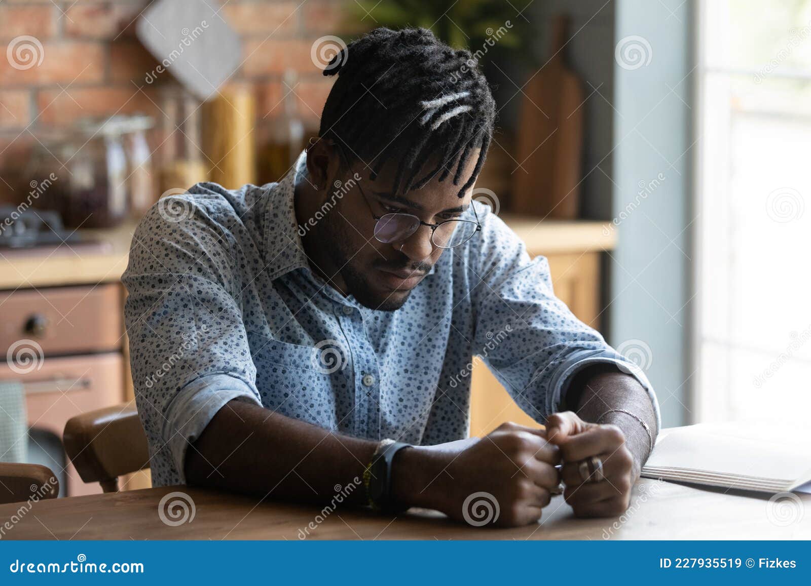 Sad Thoughtful Black Guy Sitting at Table, Getting Bored, Stock Image ...