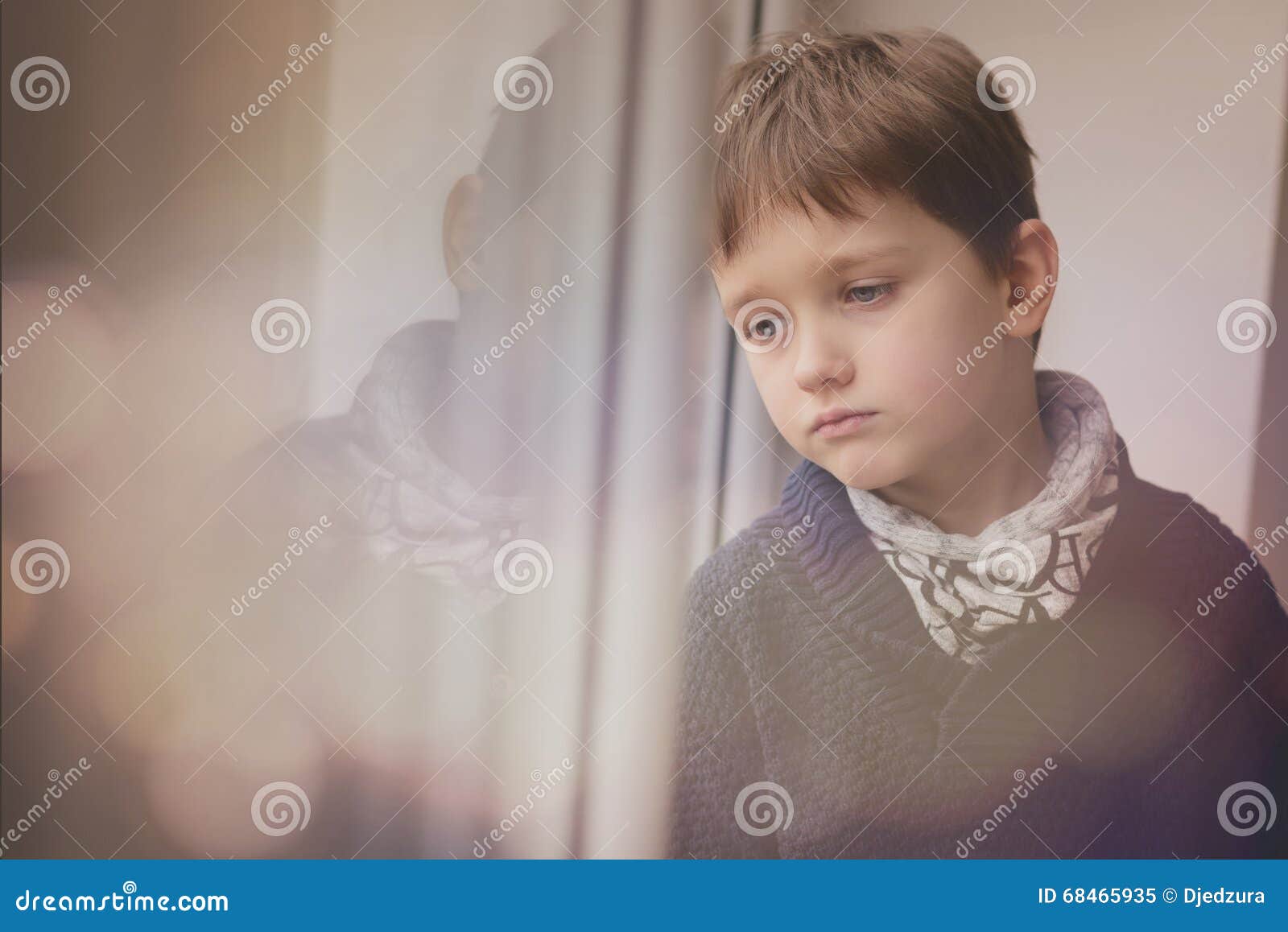 Sad Thoughtful Little Boy Looking through the Window. Stock Image ...