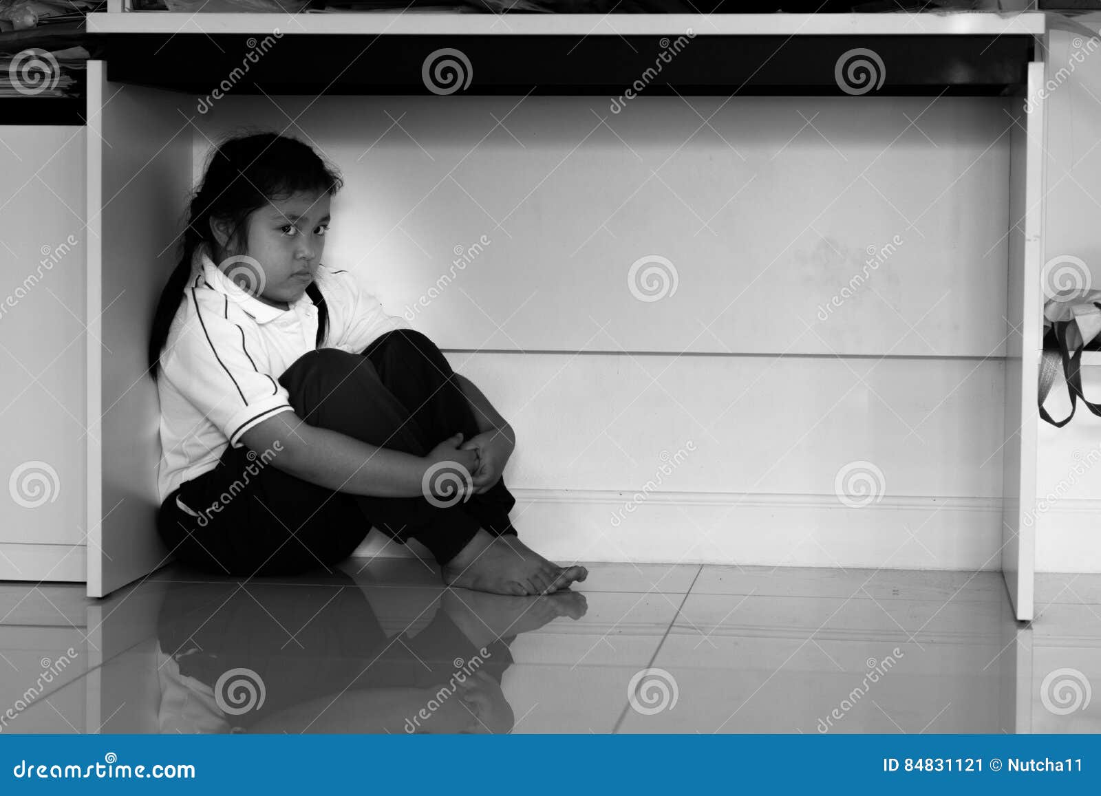 Sad Upset Unhappy Boy Kid Hiding Under The Table. Stock Image ...