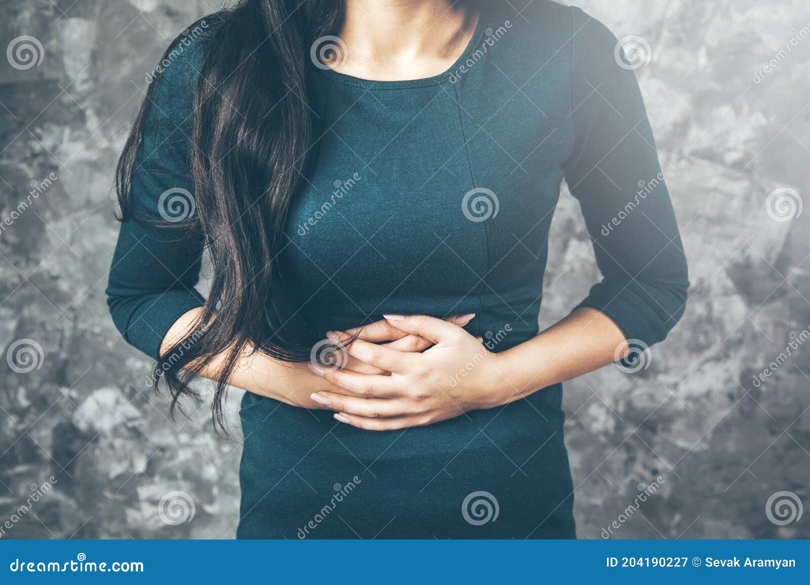 Sad woman hand in stomach stock image. Image of tummy - 204190227