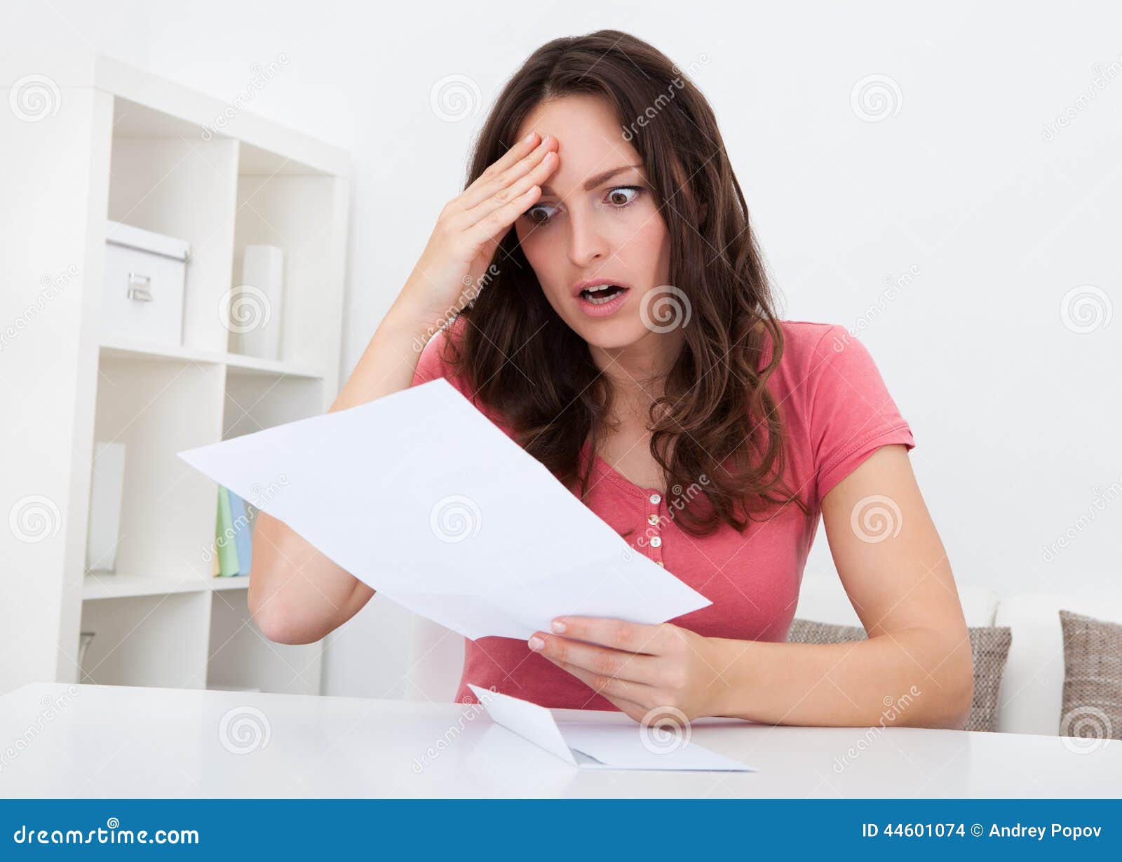 Sad woman reading paper stock photo. Image of business - 44601074