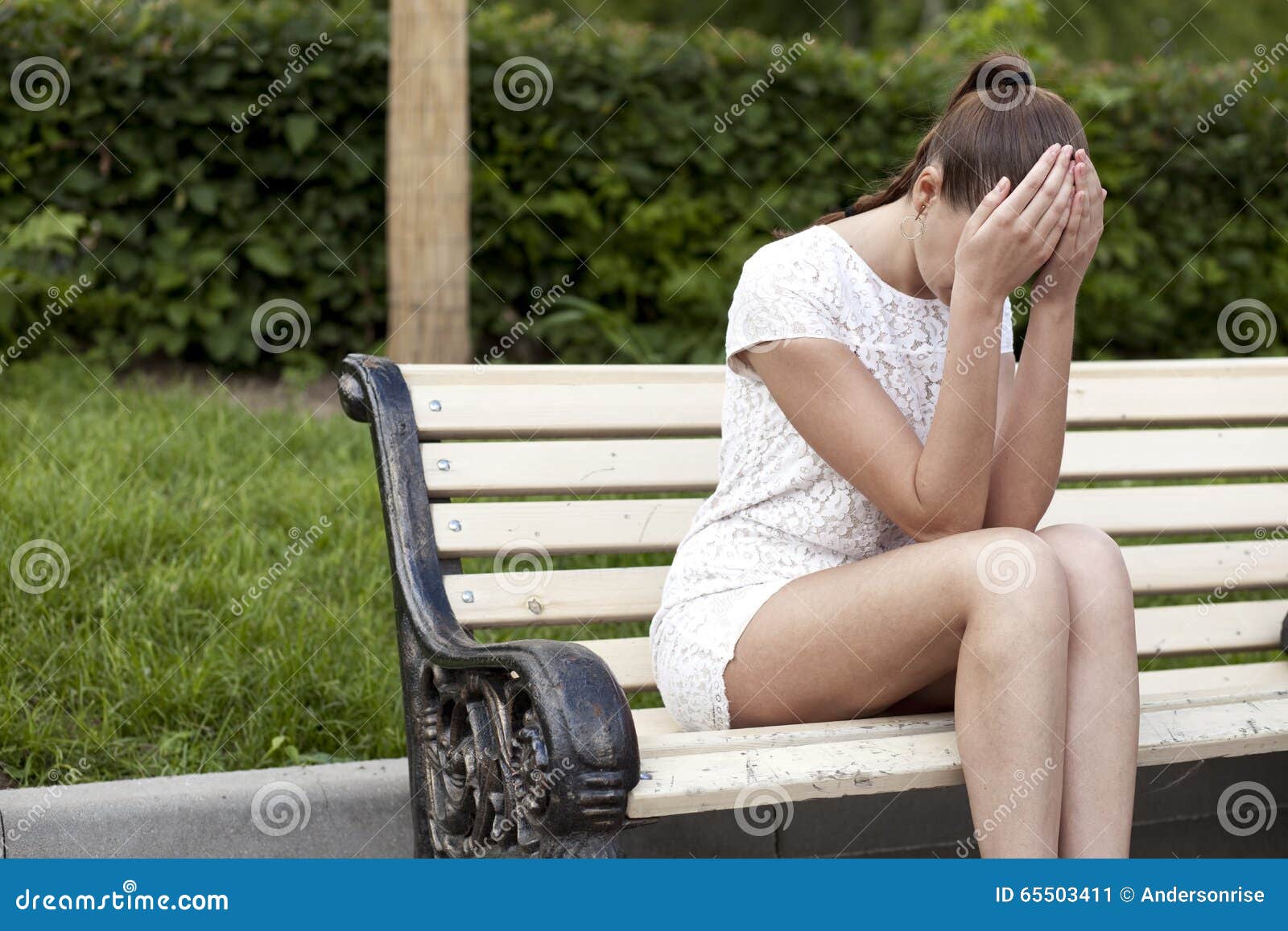 Sad woman sitting on bench stock image. Image of grief - 65503411