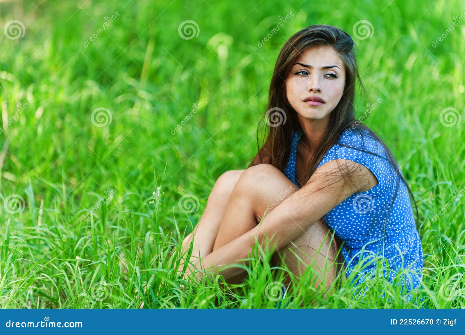 Sad woman sitting on grass stock photo. Image of background - 22526670