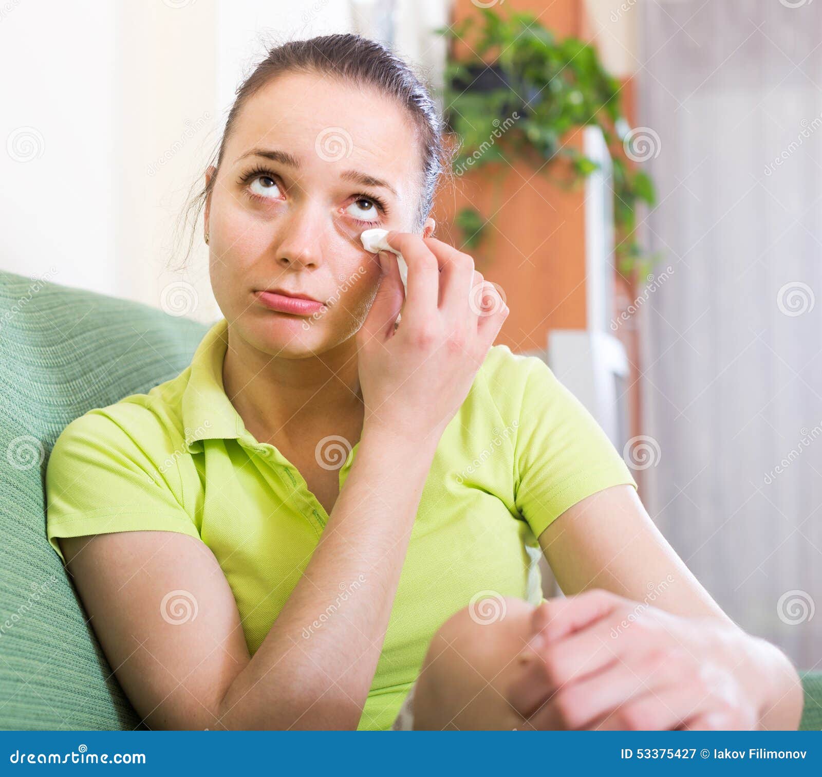 Sad woman sitting at home stock image. Image of alone - 53375427